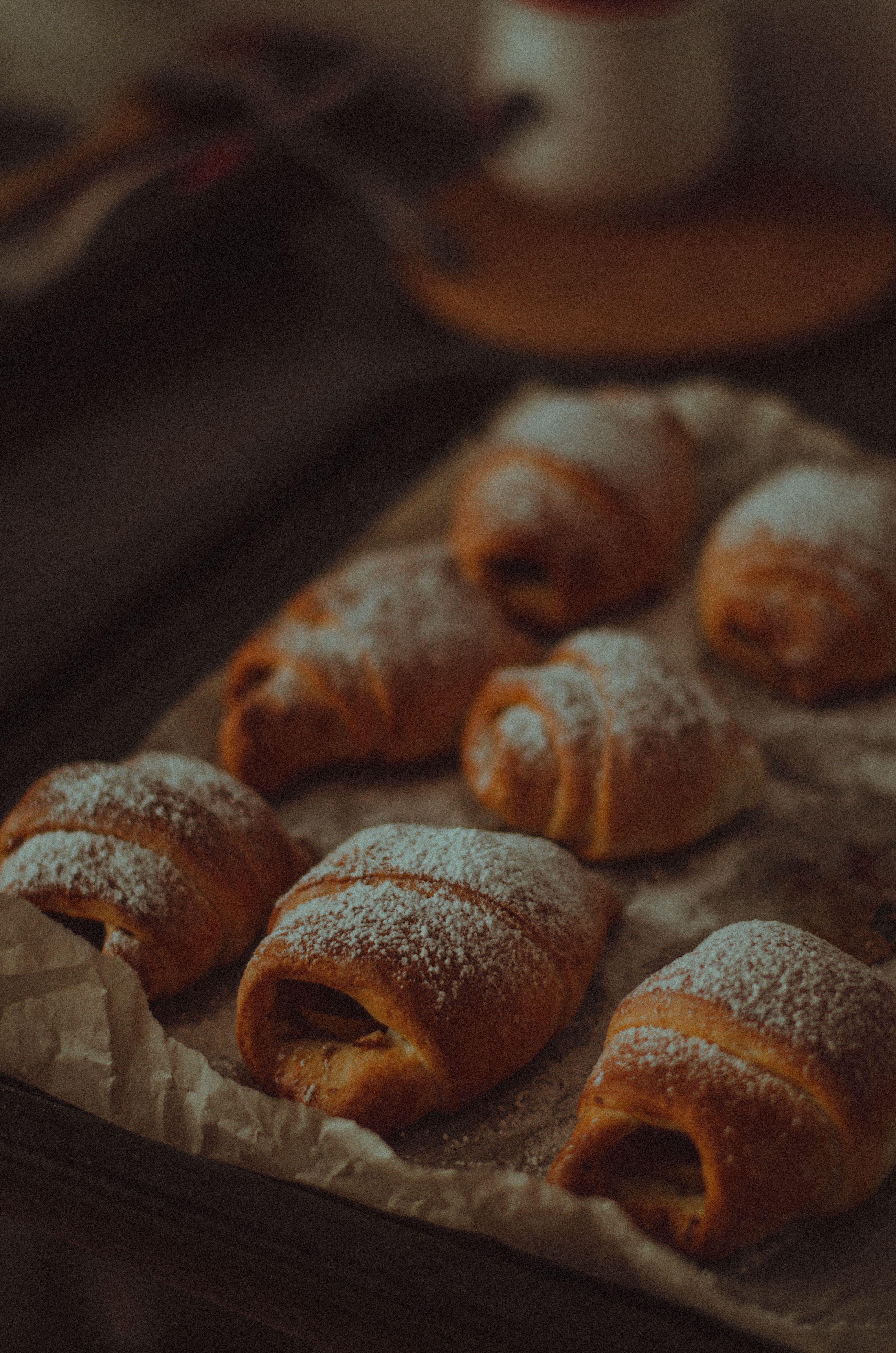Newly Baked Breads on Brown Paper · Free Stock Photo