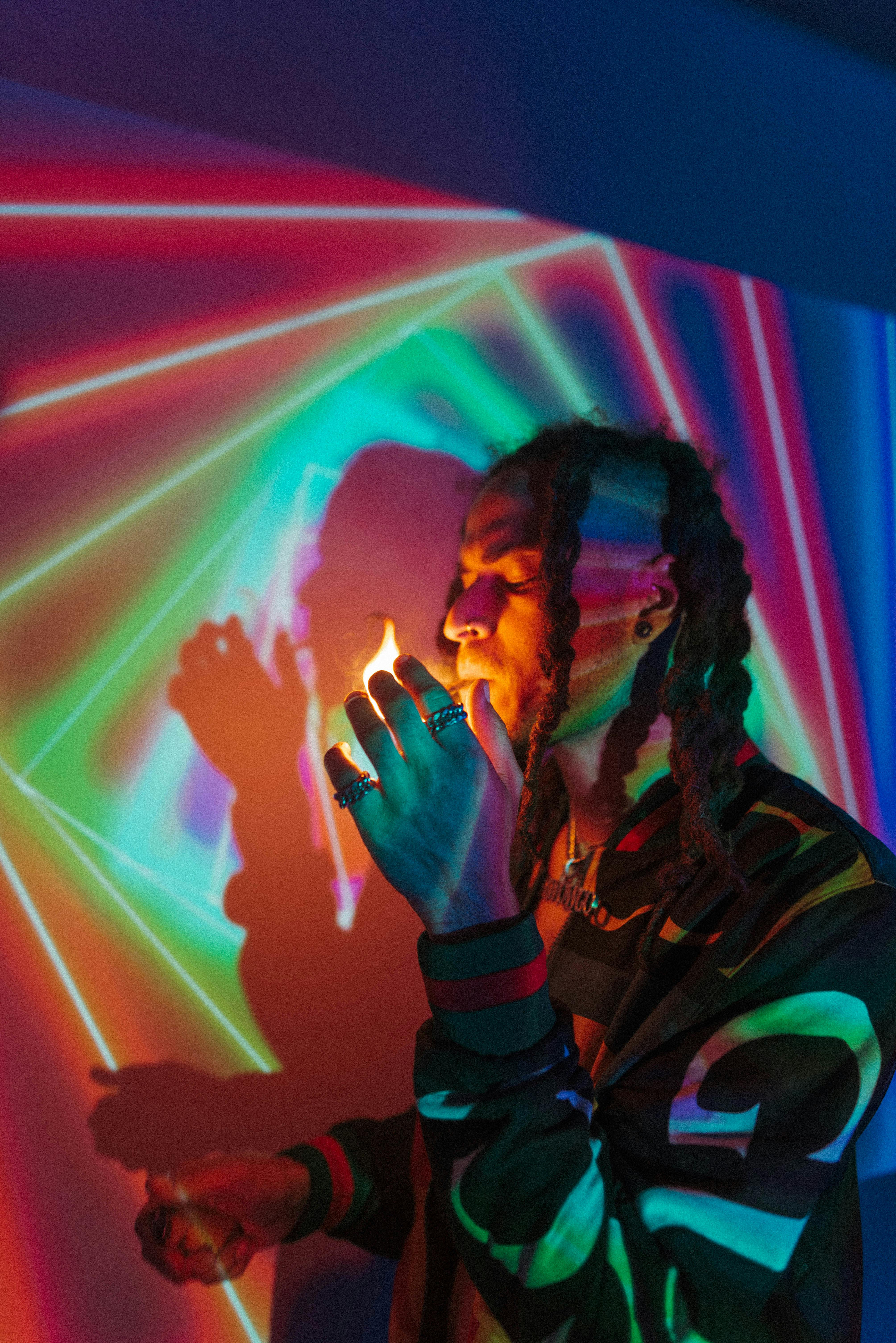 A Man with Dreadlocks Smoking · Free Stock Photo