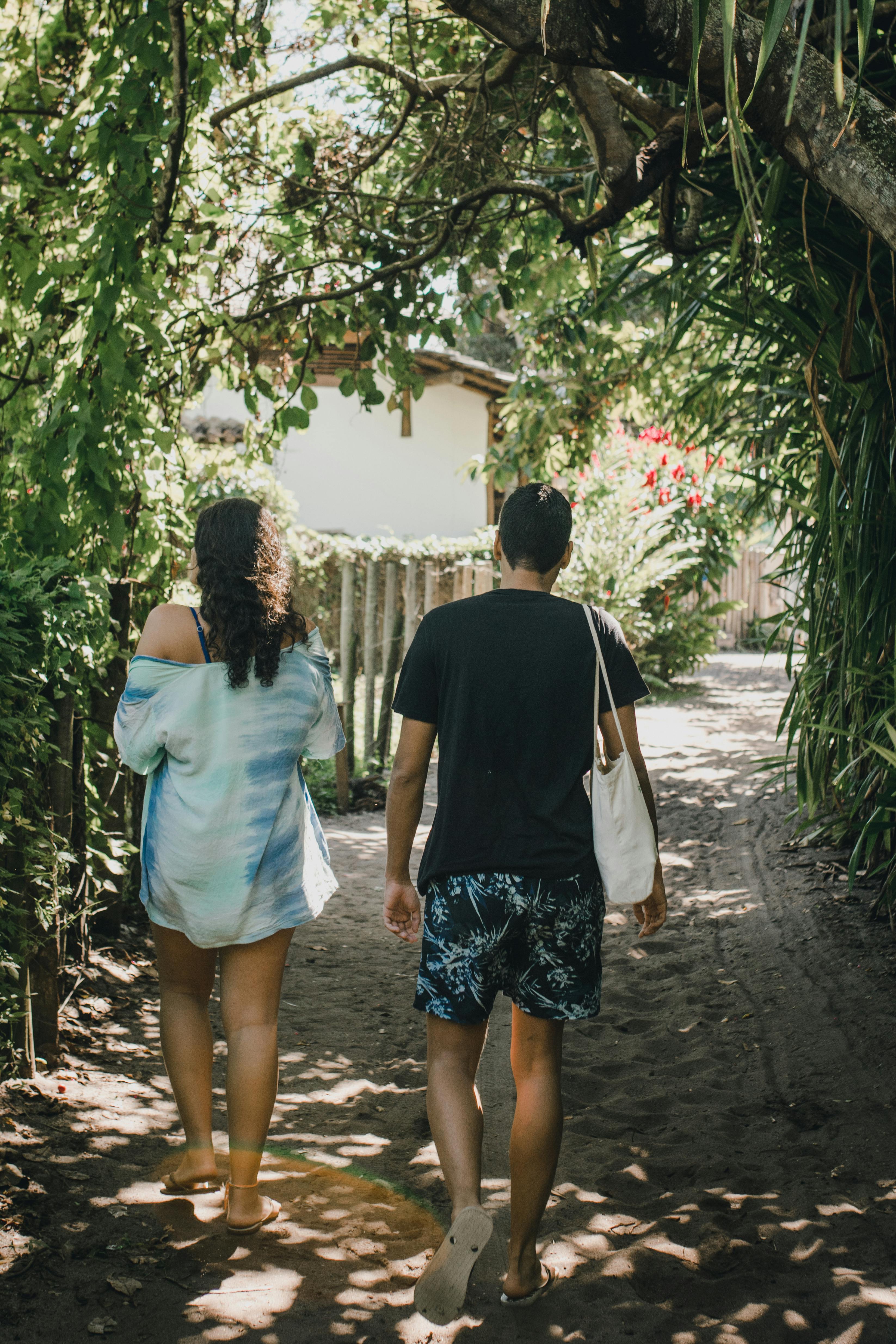 Man and Woman Walking on a Pathway · Free Stock Photo