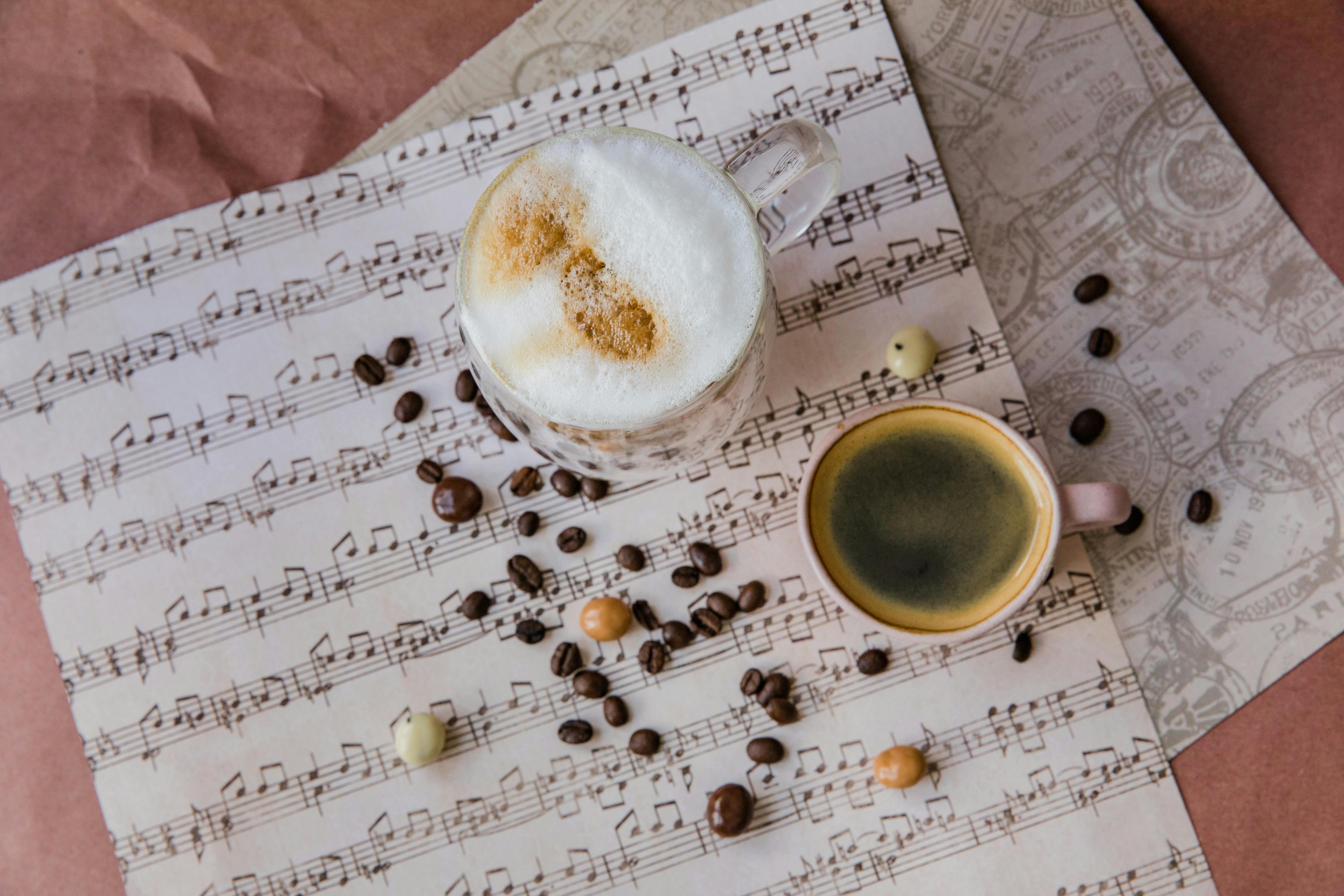 A Cup of Coffee on Top of a Musical Notes · Free Stock Photo