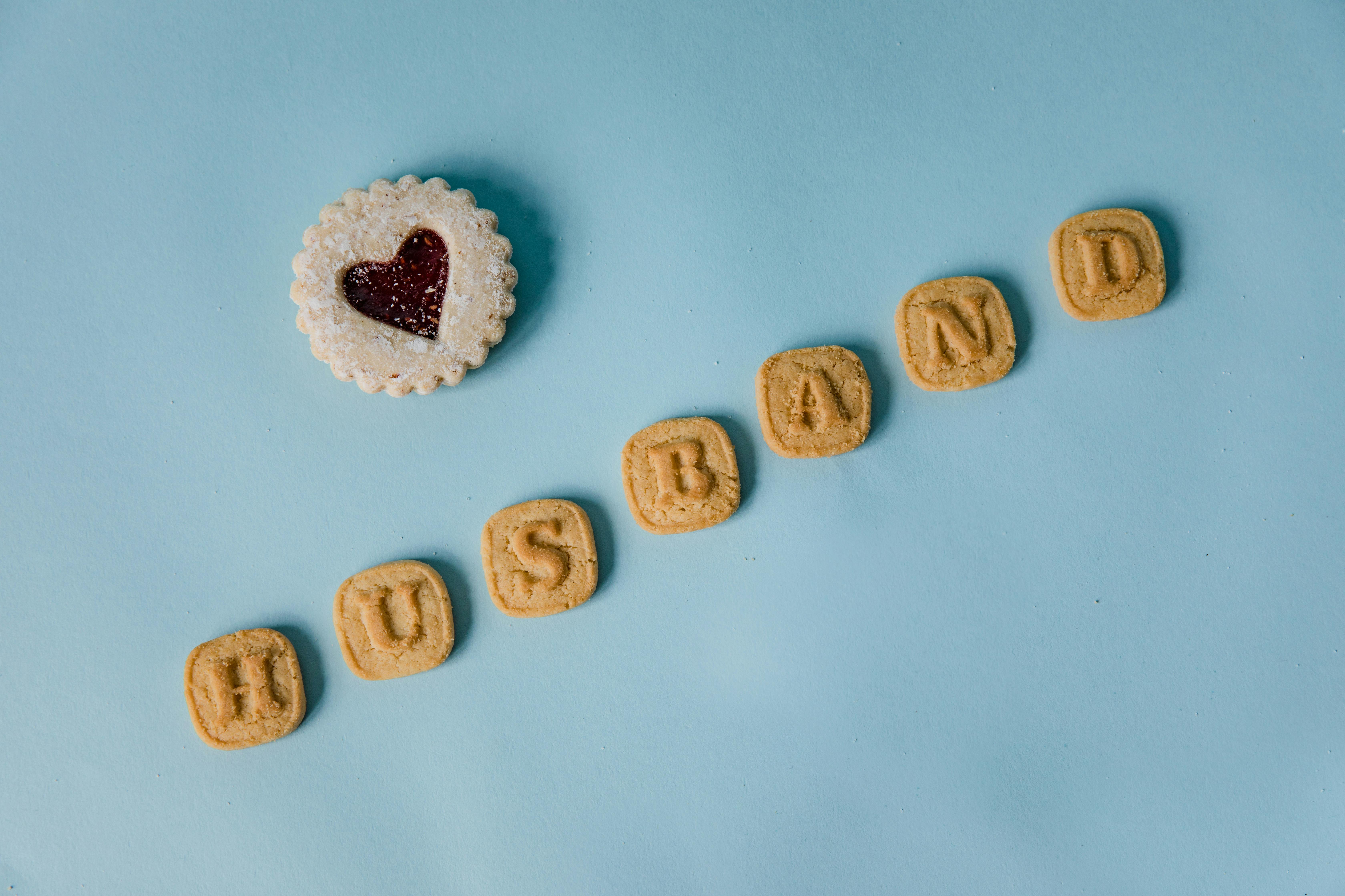 Person Tying the Ribbon on Cardboard Box · Free Stock Photo