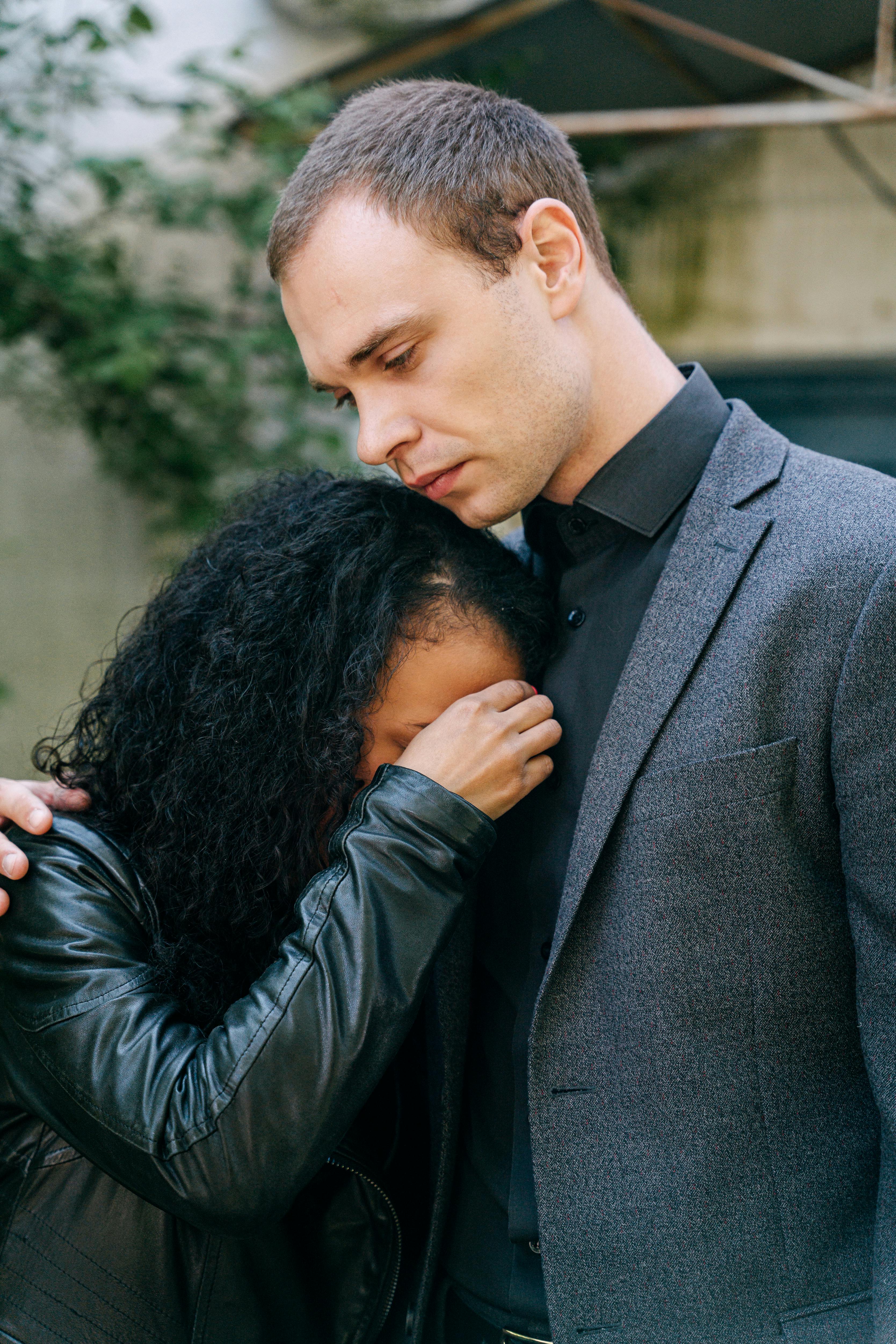 A Man Consoling a Woman · Free Stock Photo