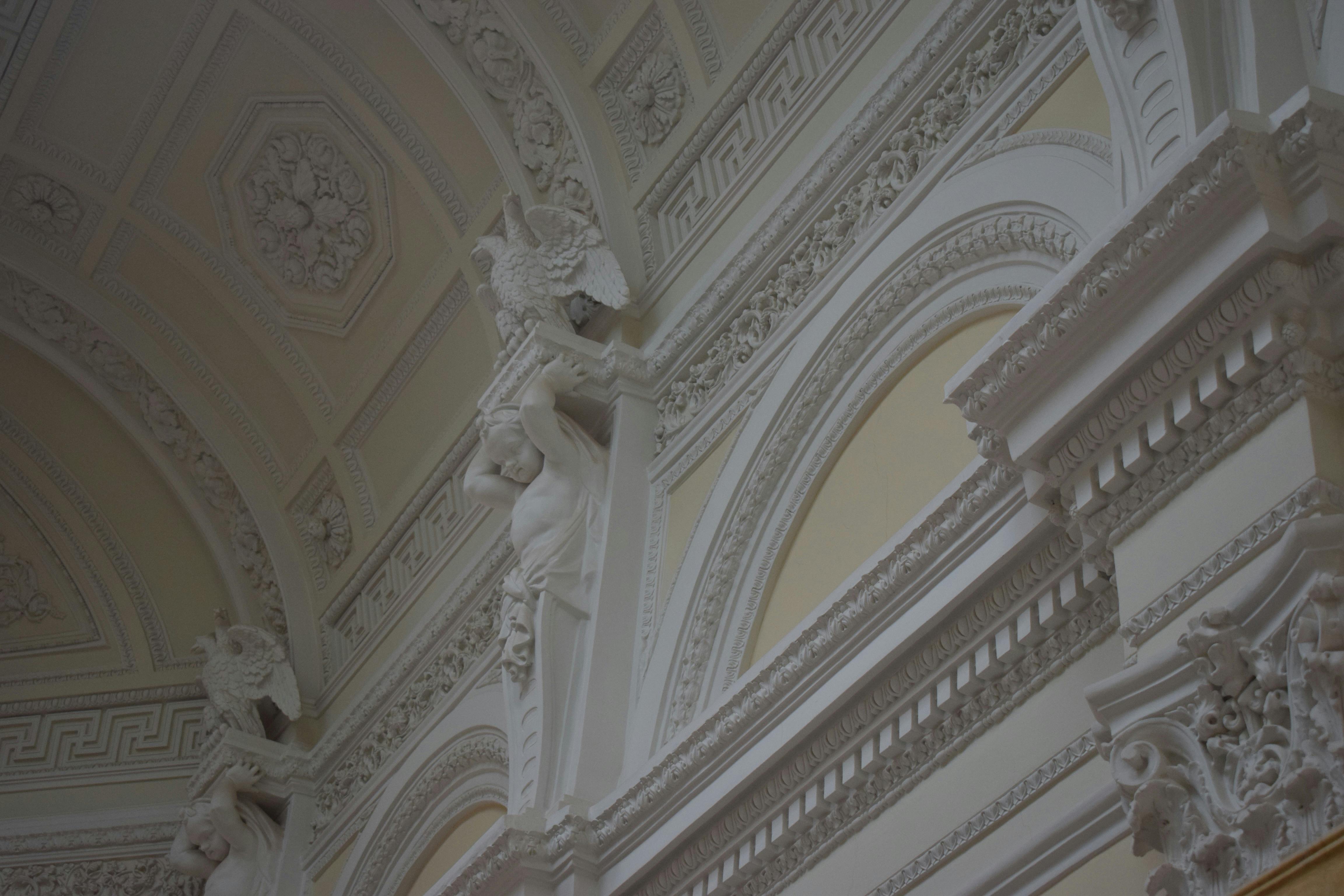 A Statue Leaning on a Wall · Free Stock Photo