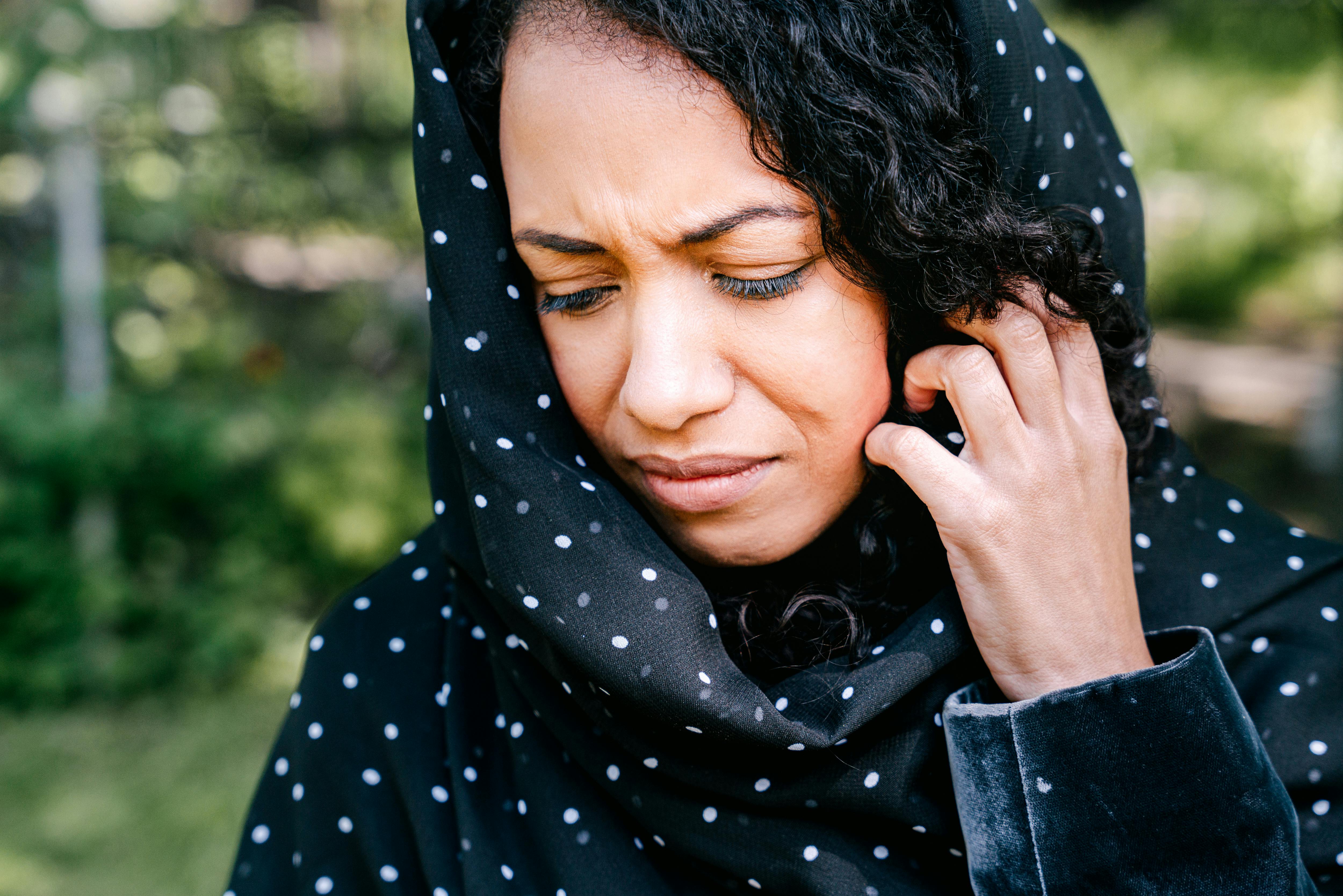A Close-Up Shot of a Grieving Woman · Free Stock Photo