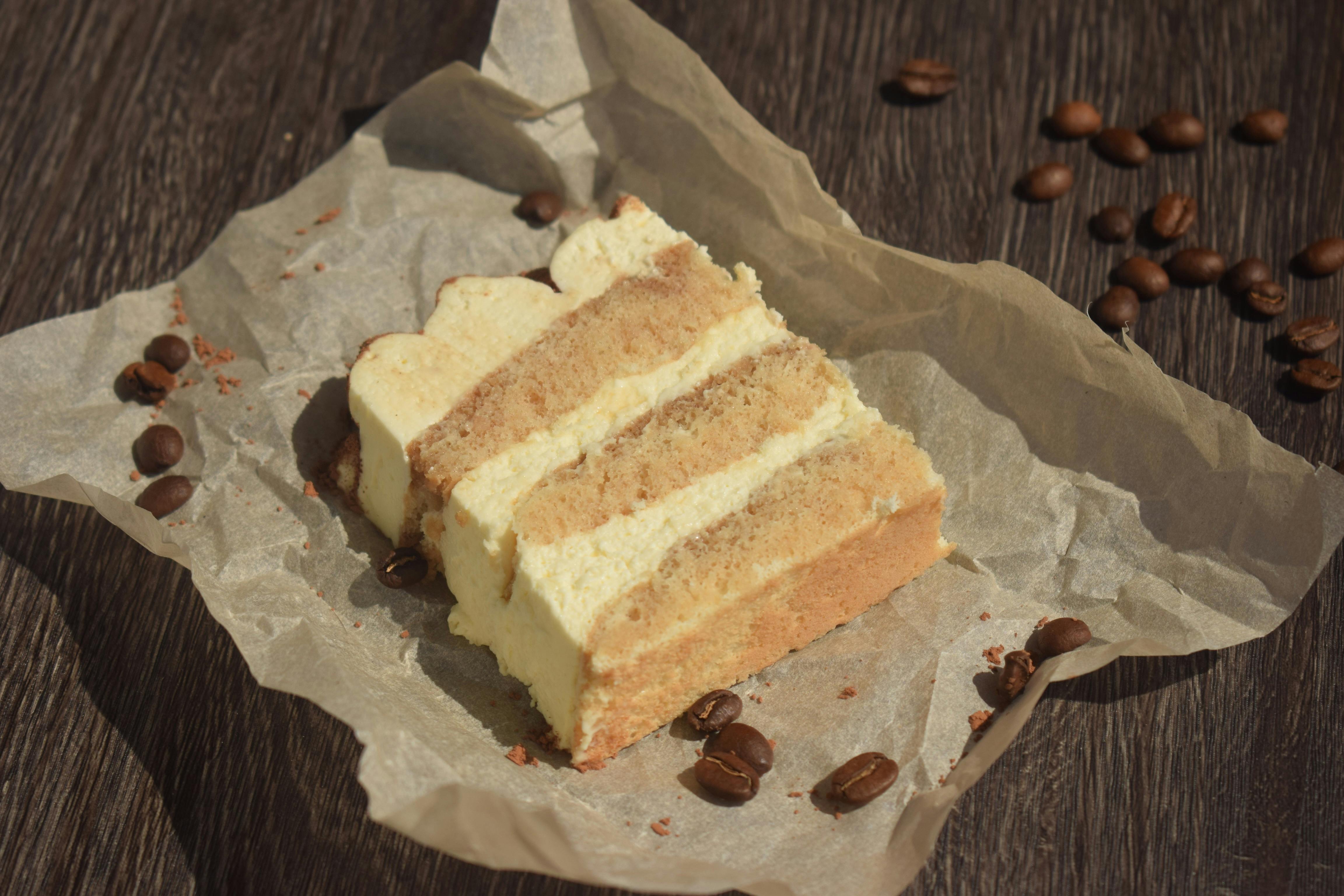 A Slice of Cake on a Parchment Paper · Free Stock Photo