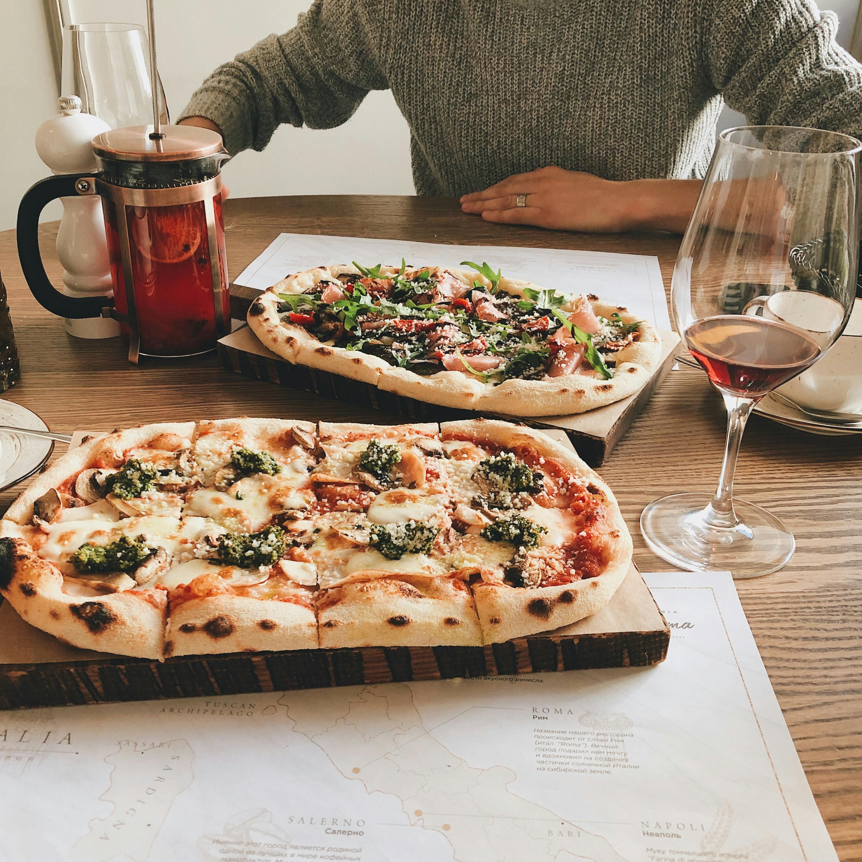 A Pizza on a Wooden Table · Free Stock Photo