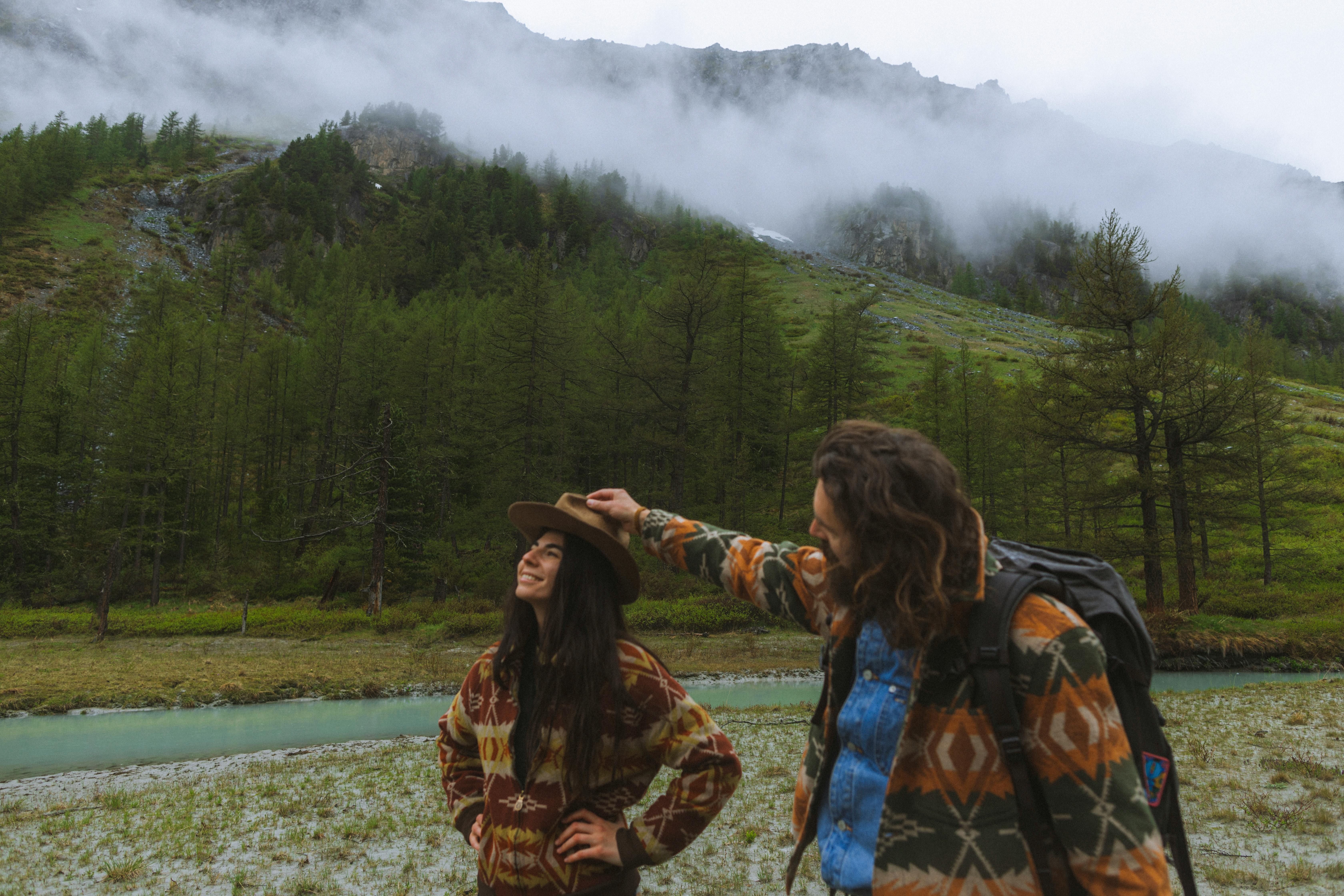 People Standing Near a River · Free Stock Photo