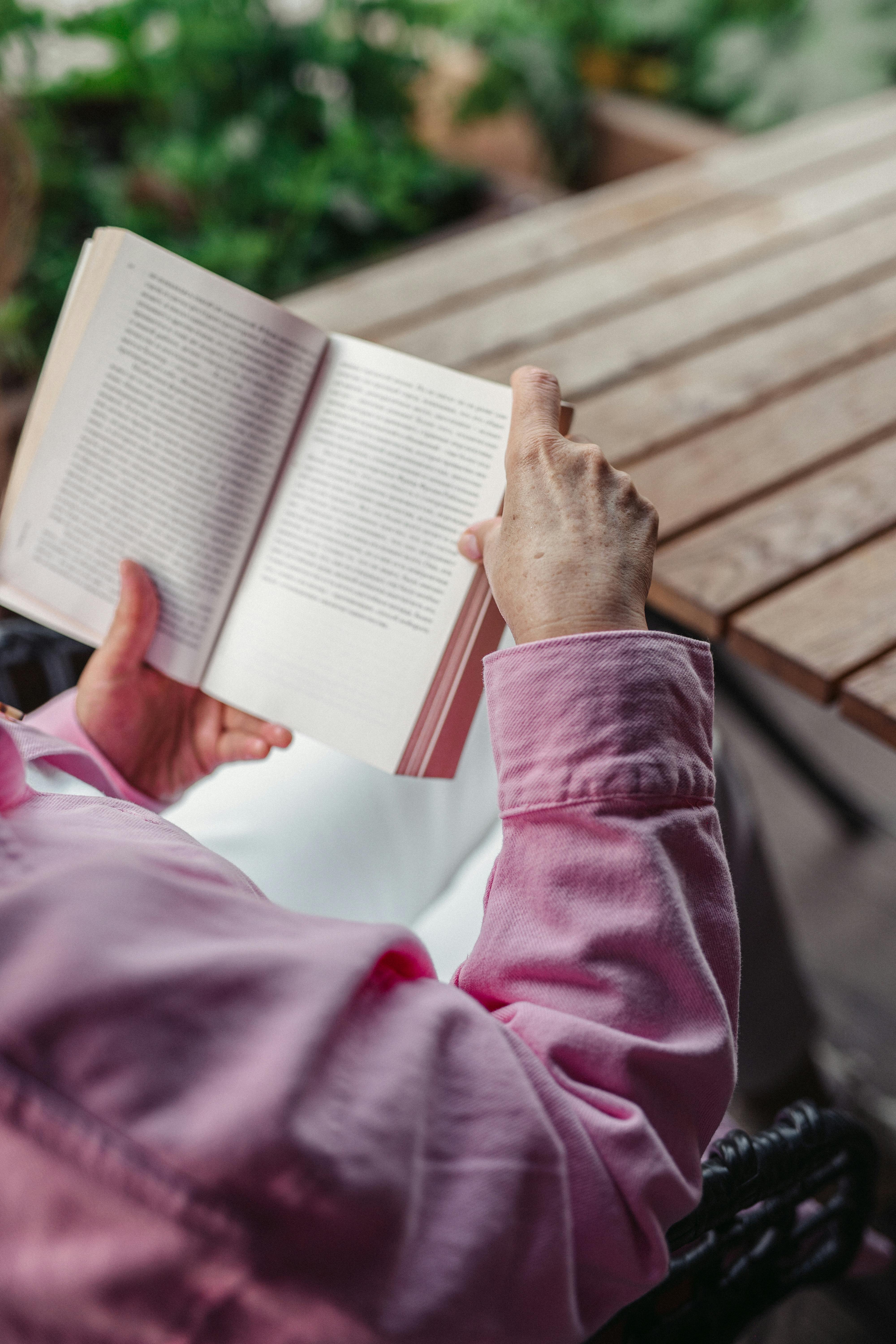 Person Holding A Book · Free Stock Photo