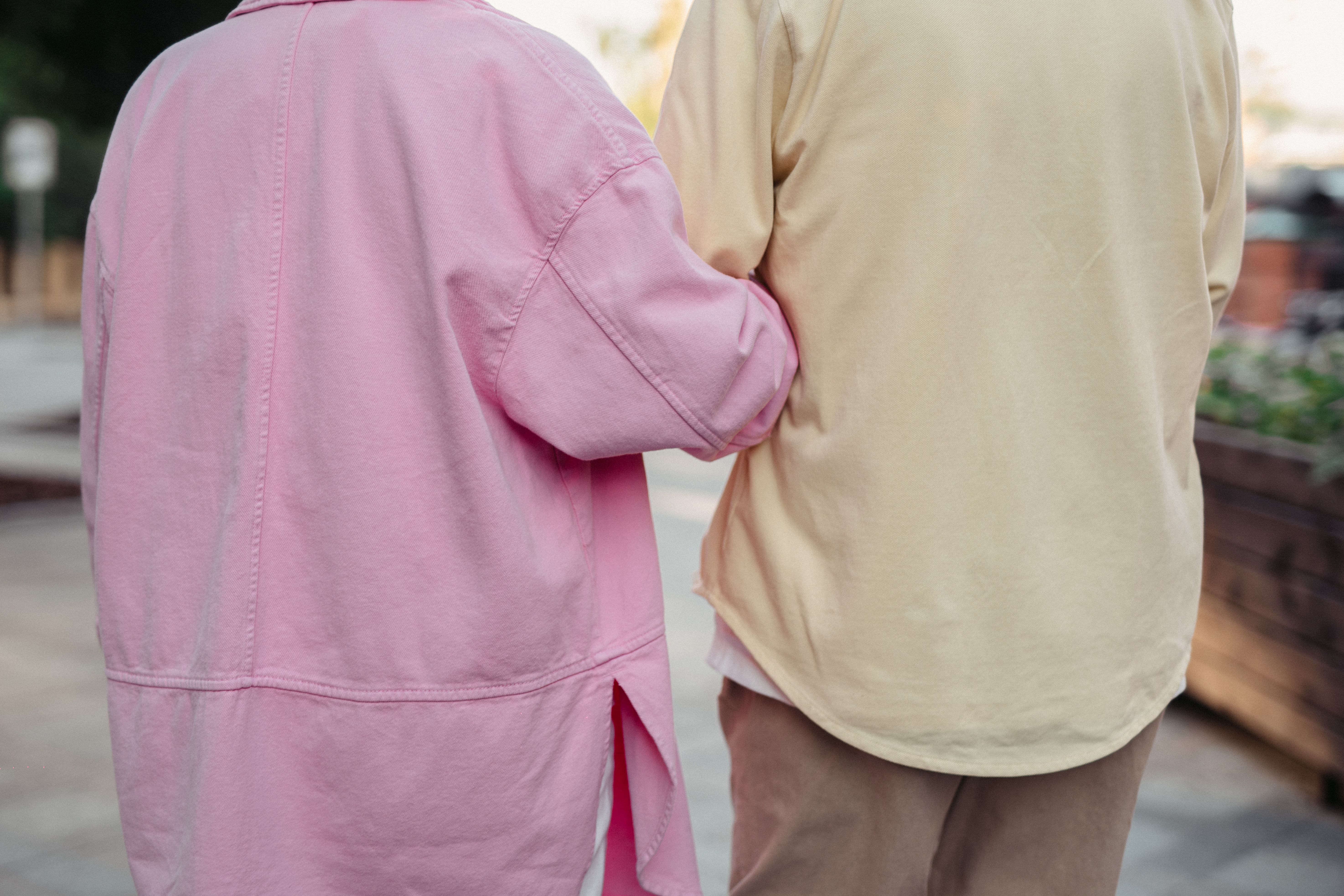 Back View of a Couple Holding Hands · Free Stock Photo