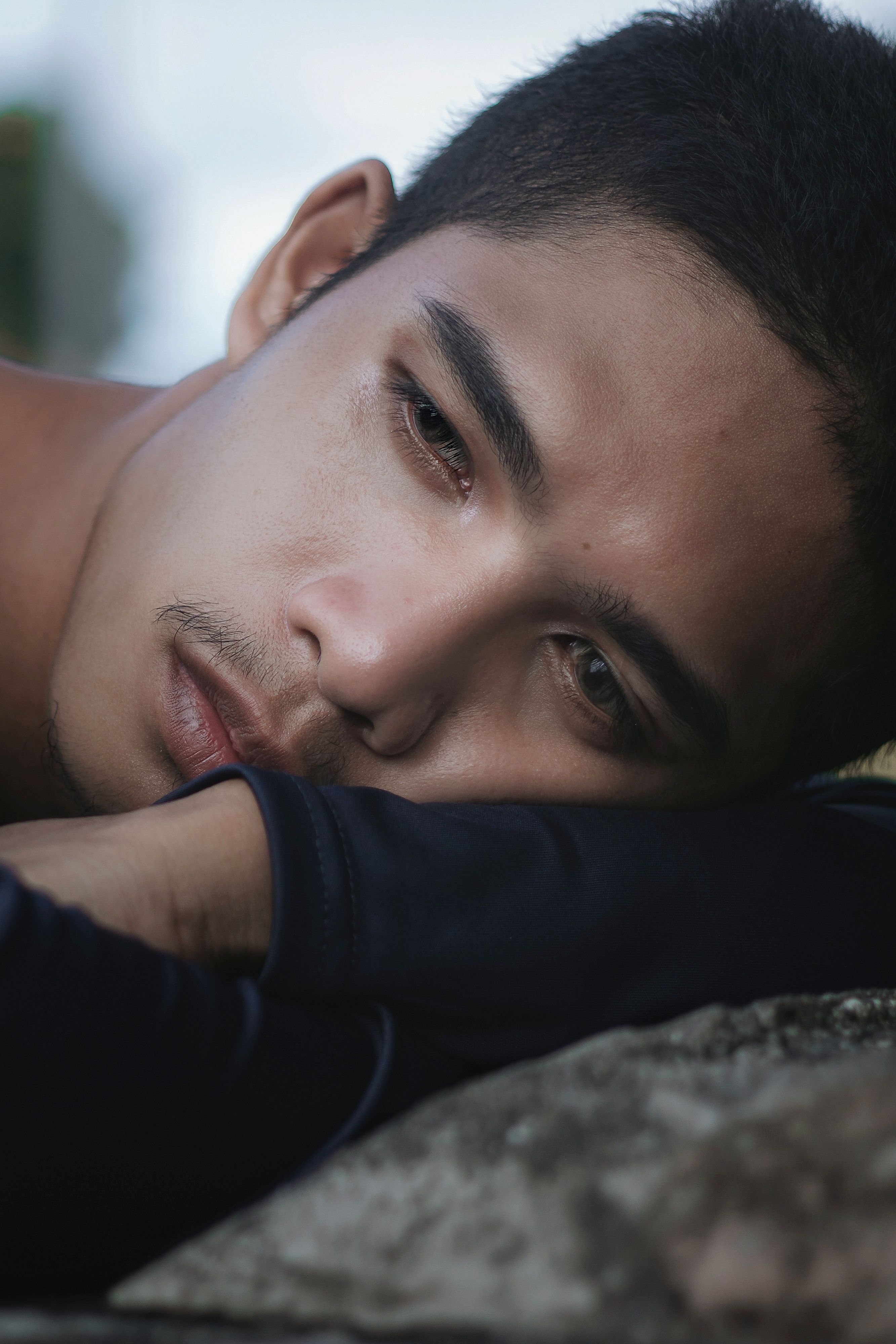 Man Lying Down and Posing · Free Stock Photo