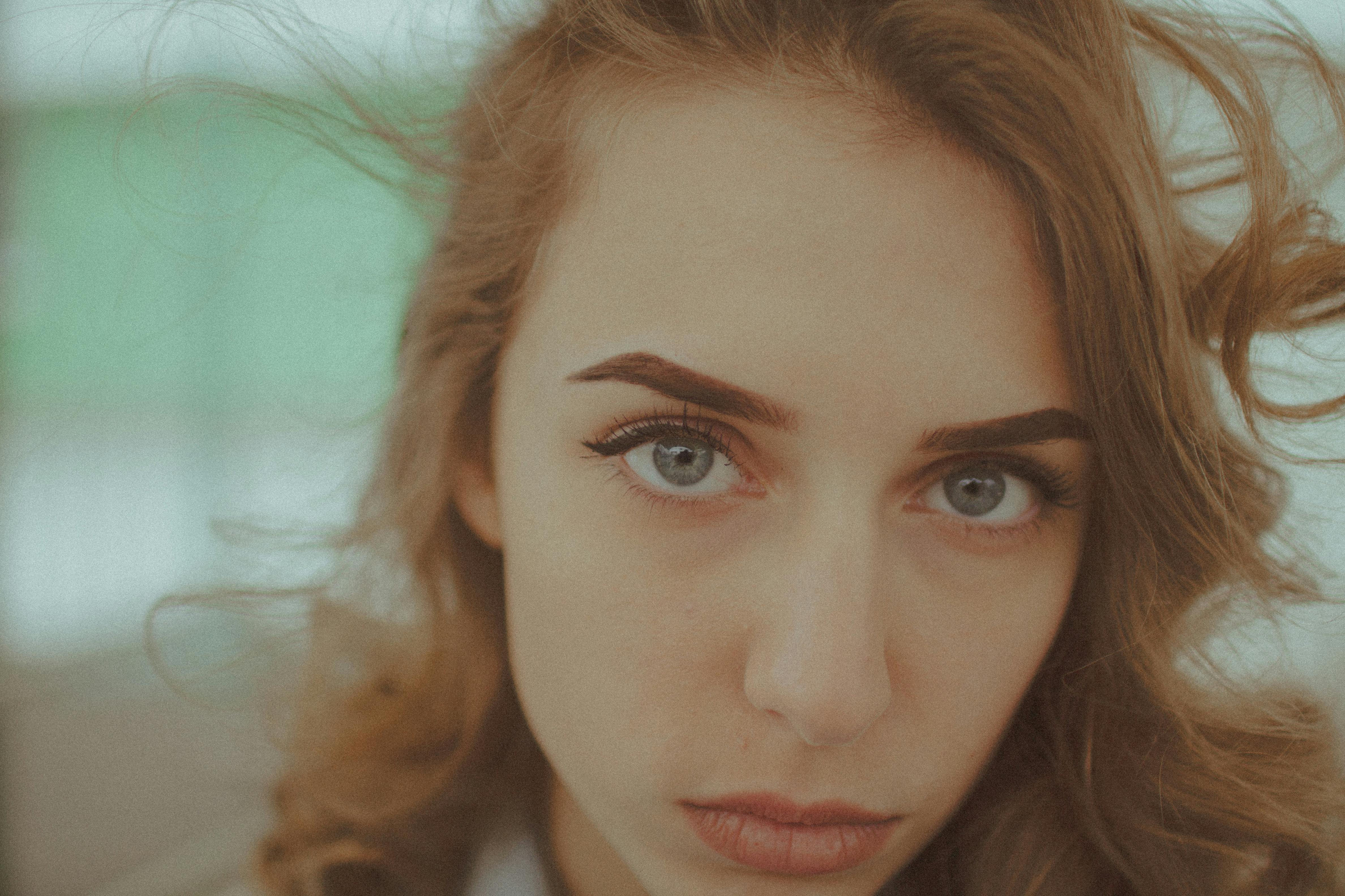 A Close-Up Shot of a Woman's Face · Free Stock Photo