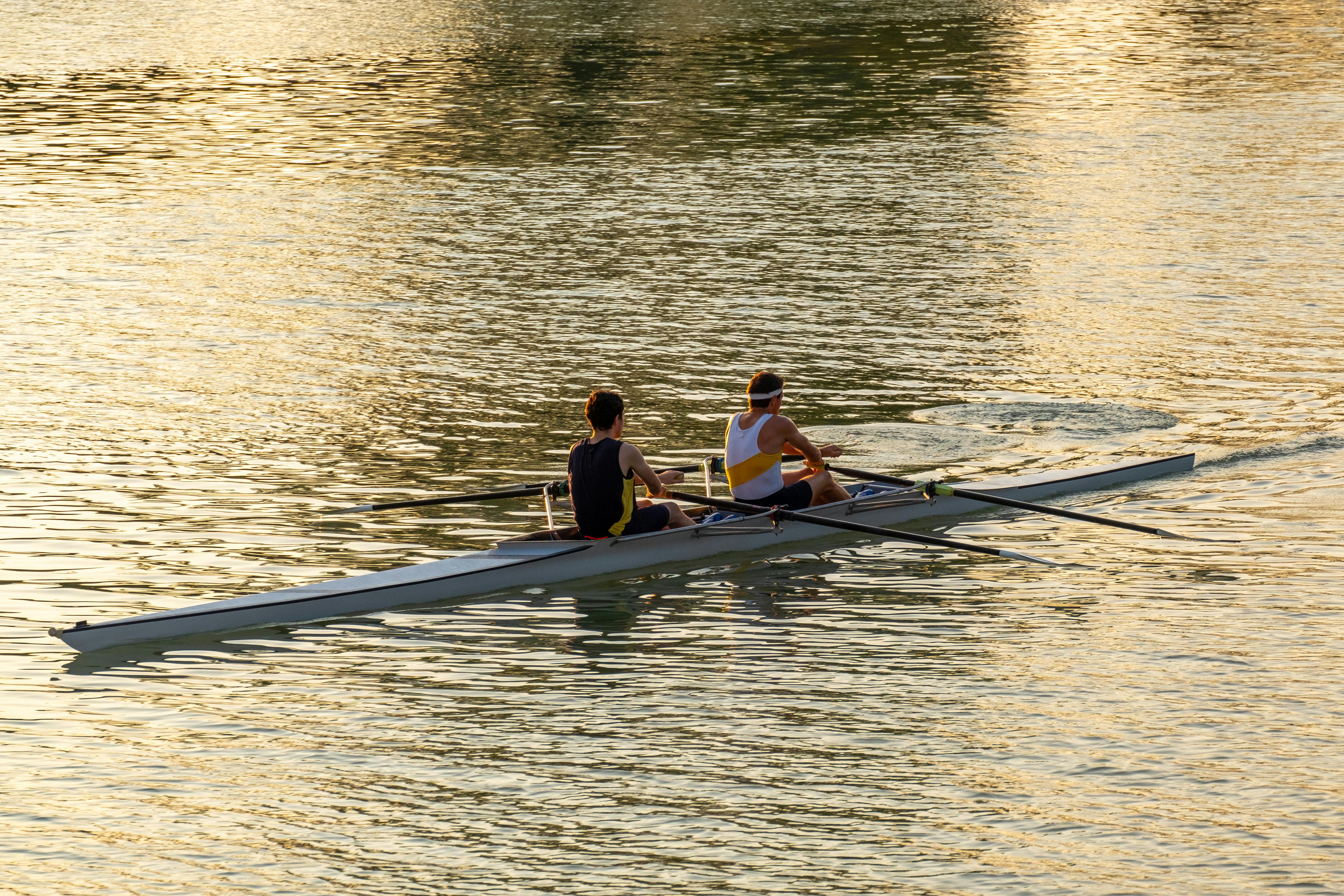 Men Rowing Together on the Lake · Free Stock Photo