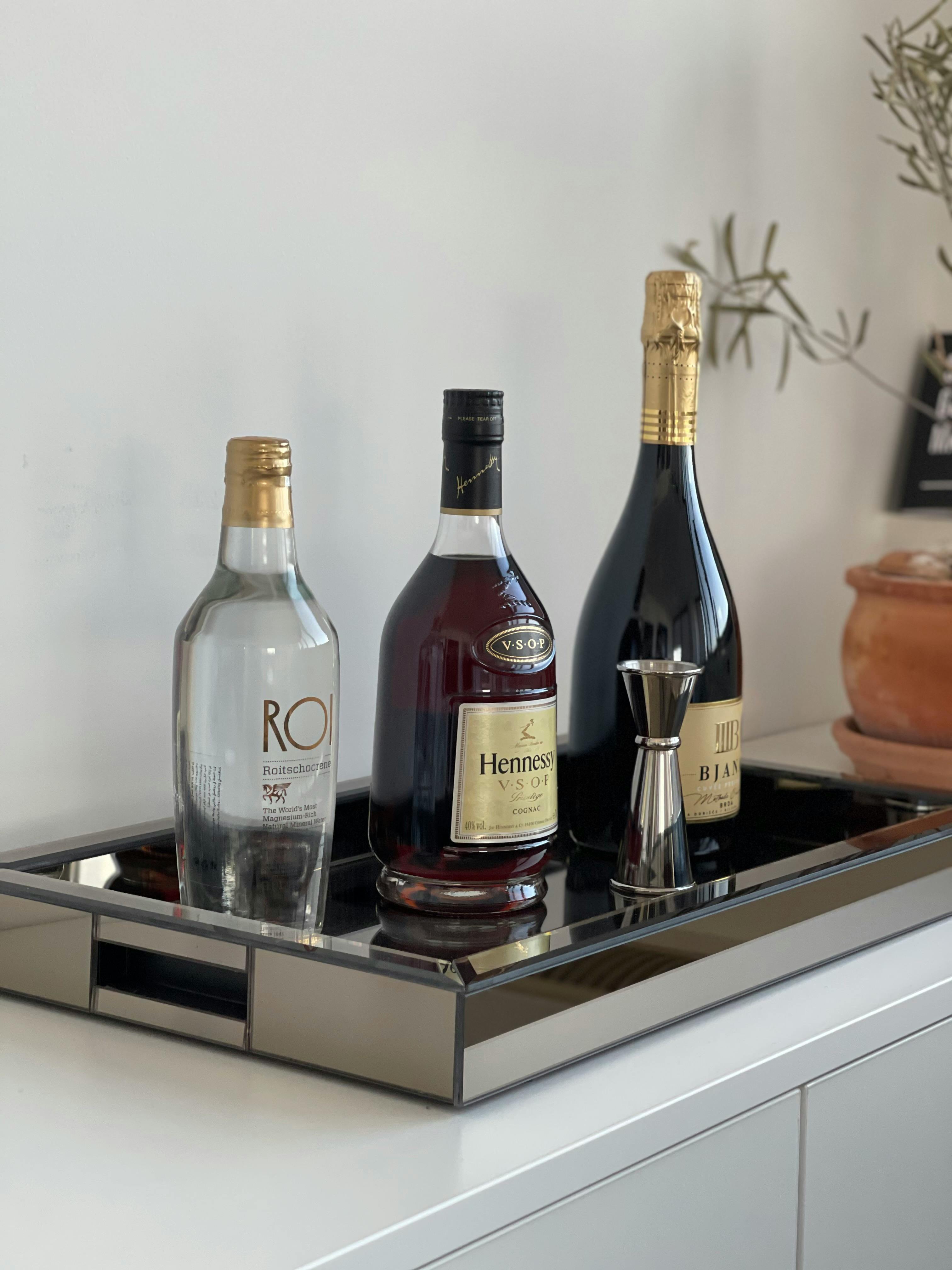Bottled Alcoholic Beverages on a Tray · Free Stock Photo