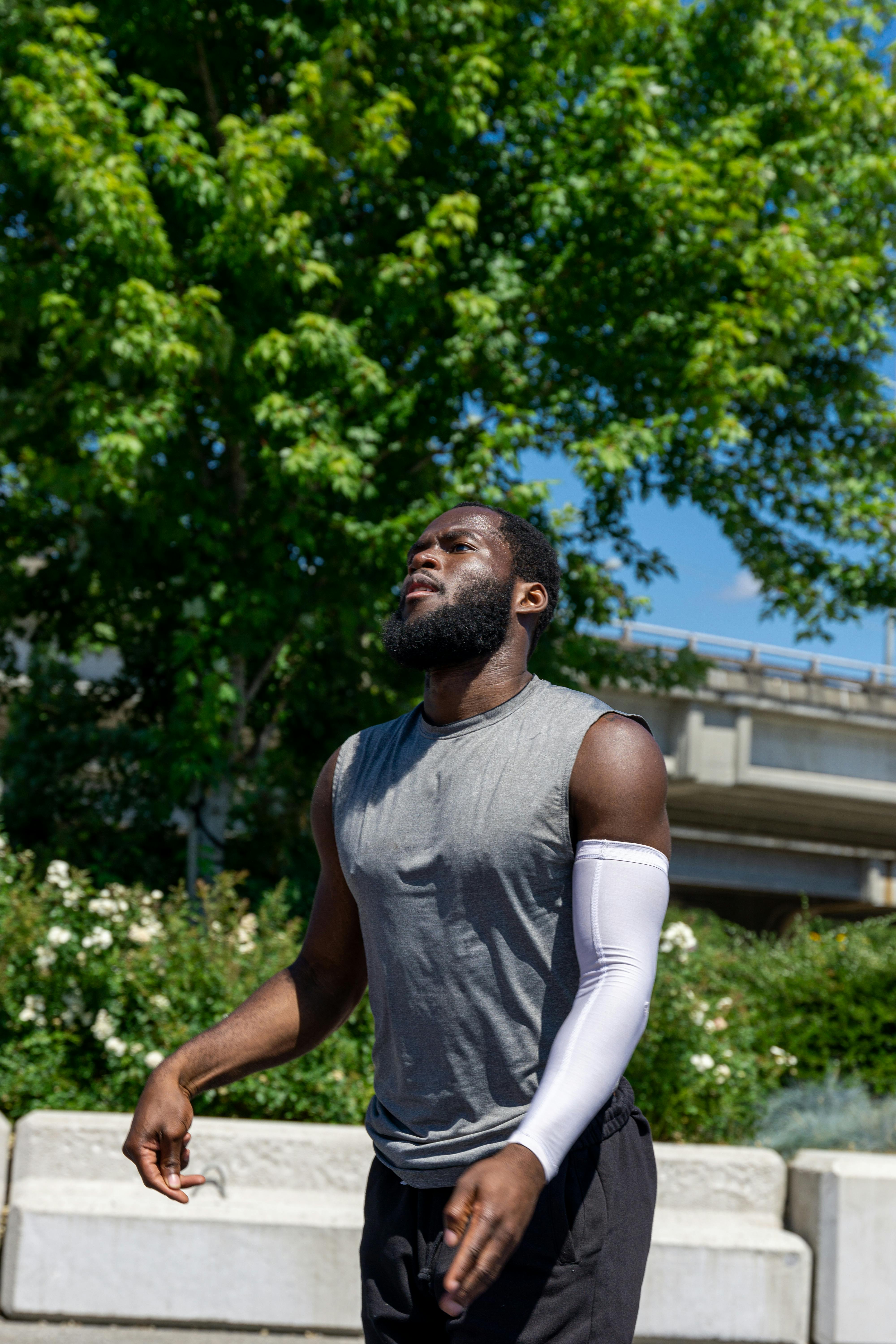 A Basketball Player Kissing a Medal · Free Stock Photo