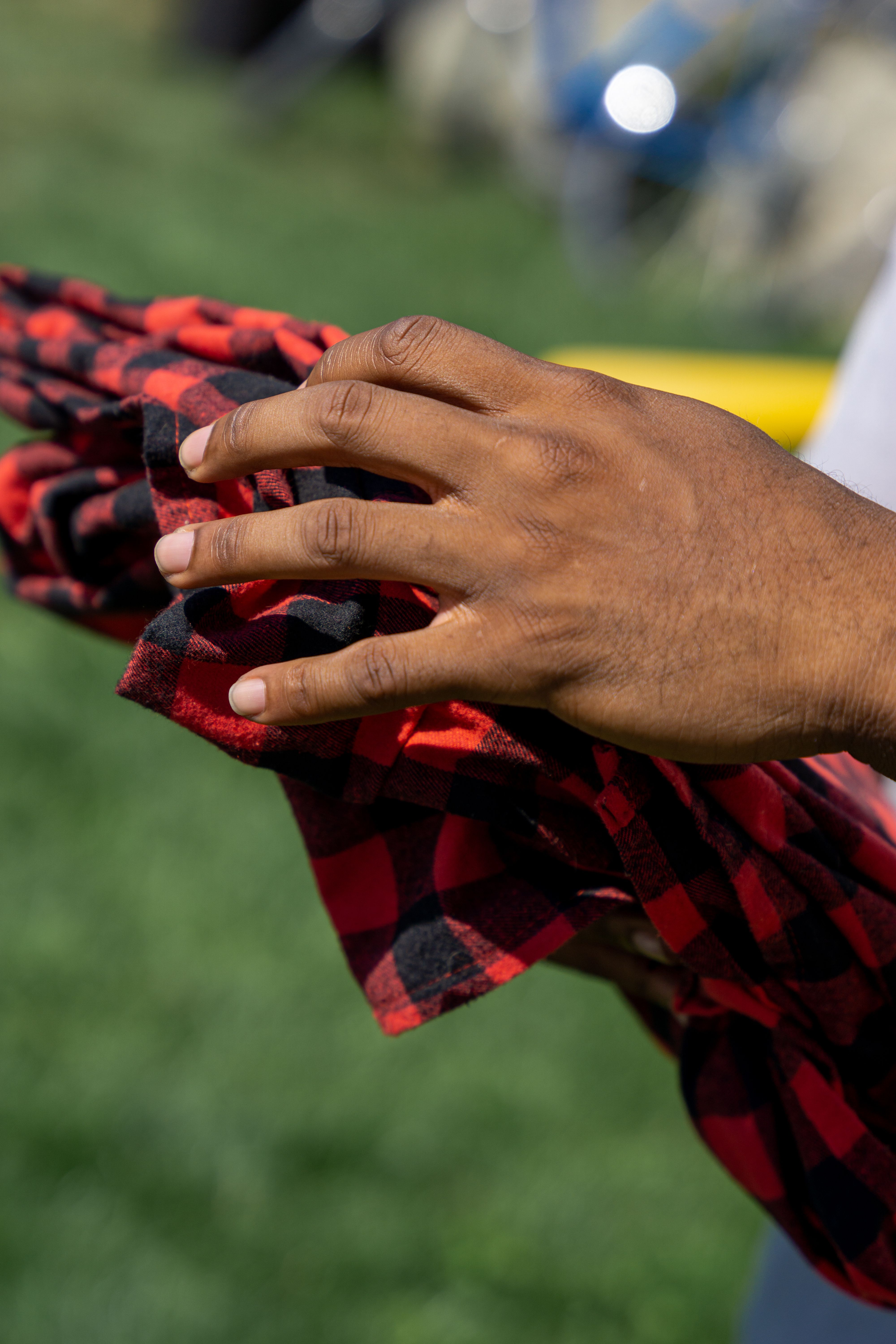 A Close-Up Shot of the Hands of a Person in a Coat · Free Stock Photo