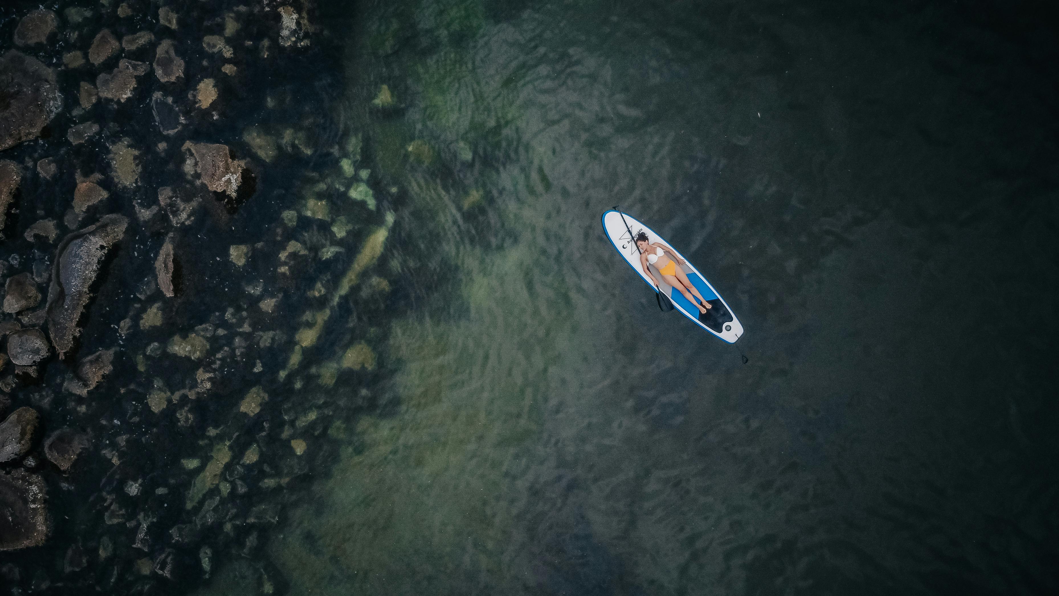 A Women wearing Swimsuit Lying Down Together · Free Stock Photo