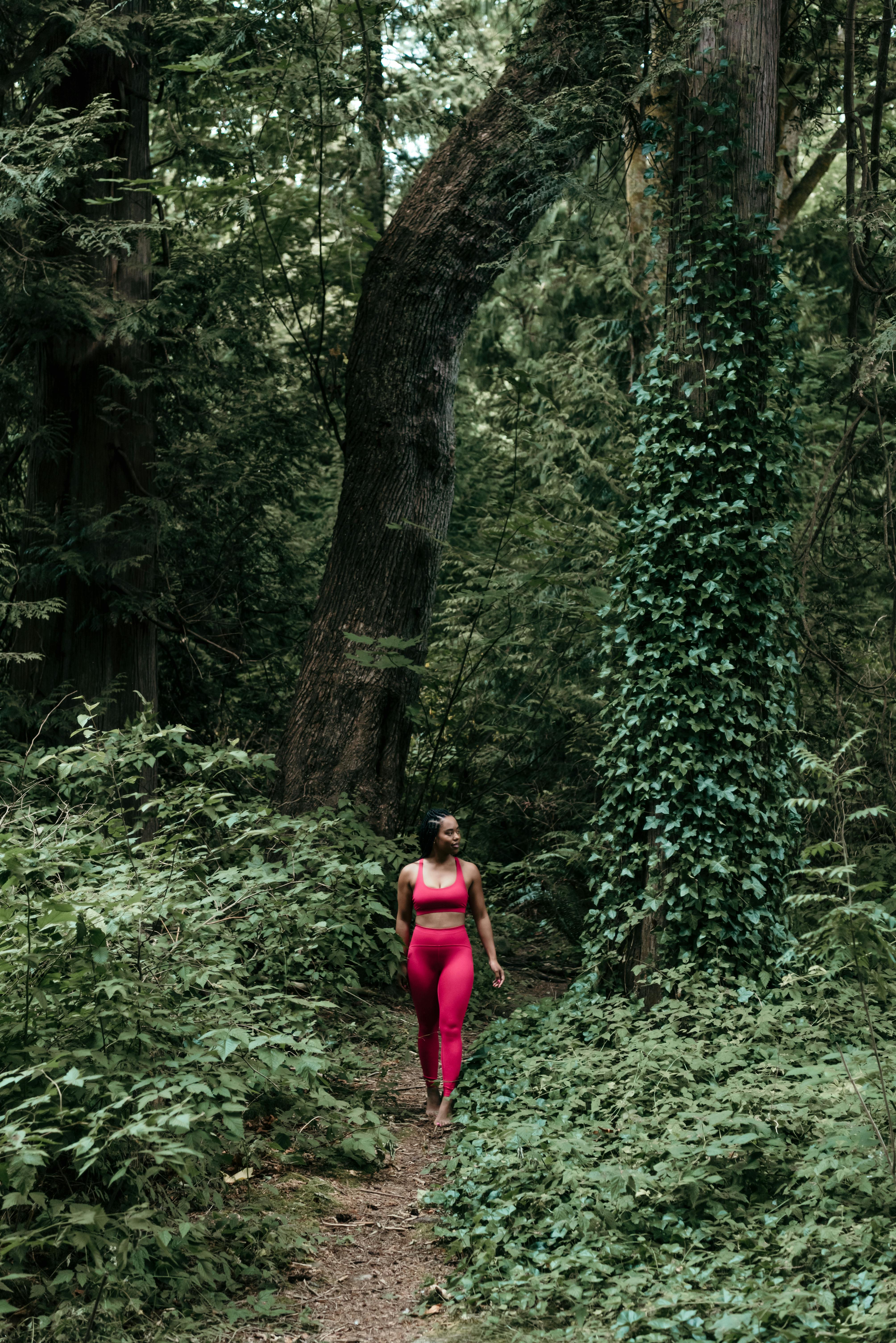 A Woman Walking in a Forest · Free Stock Photo