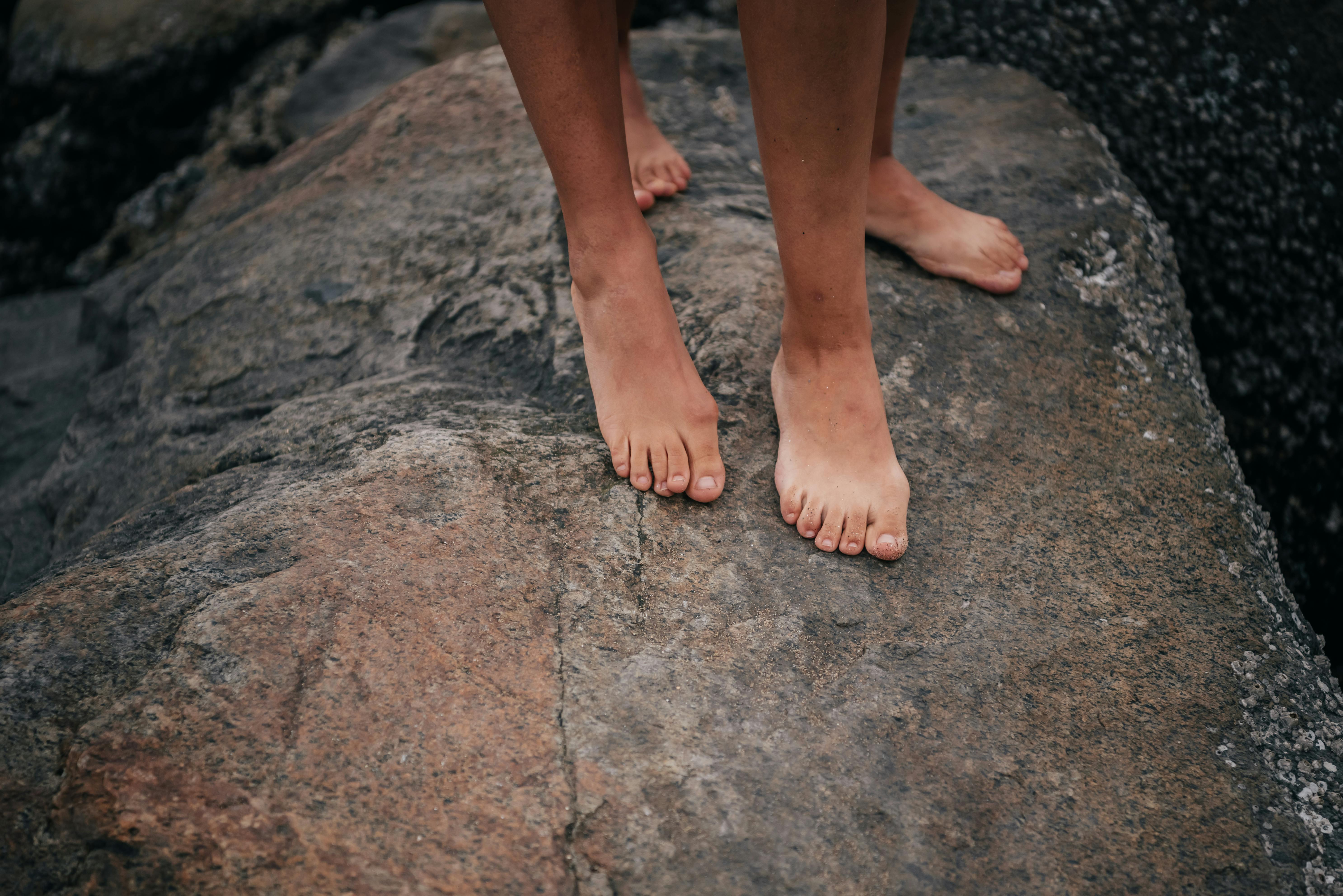 Photo of a Barefoot People Standing · Free Stock Photo
