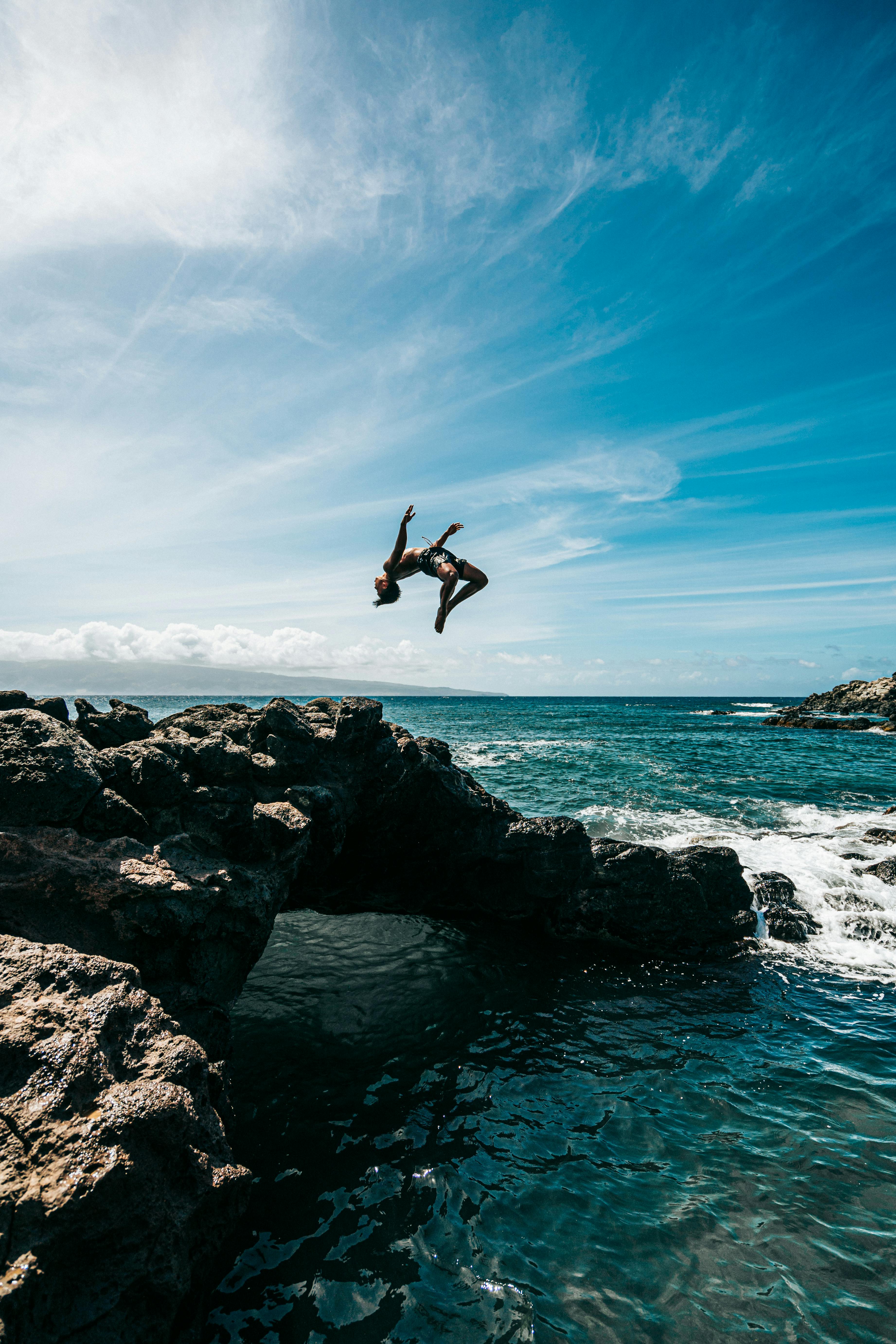 Man Jumping over Rocks · Free Stock Photo