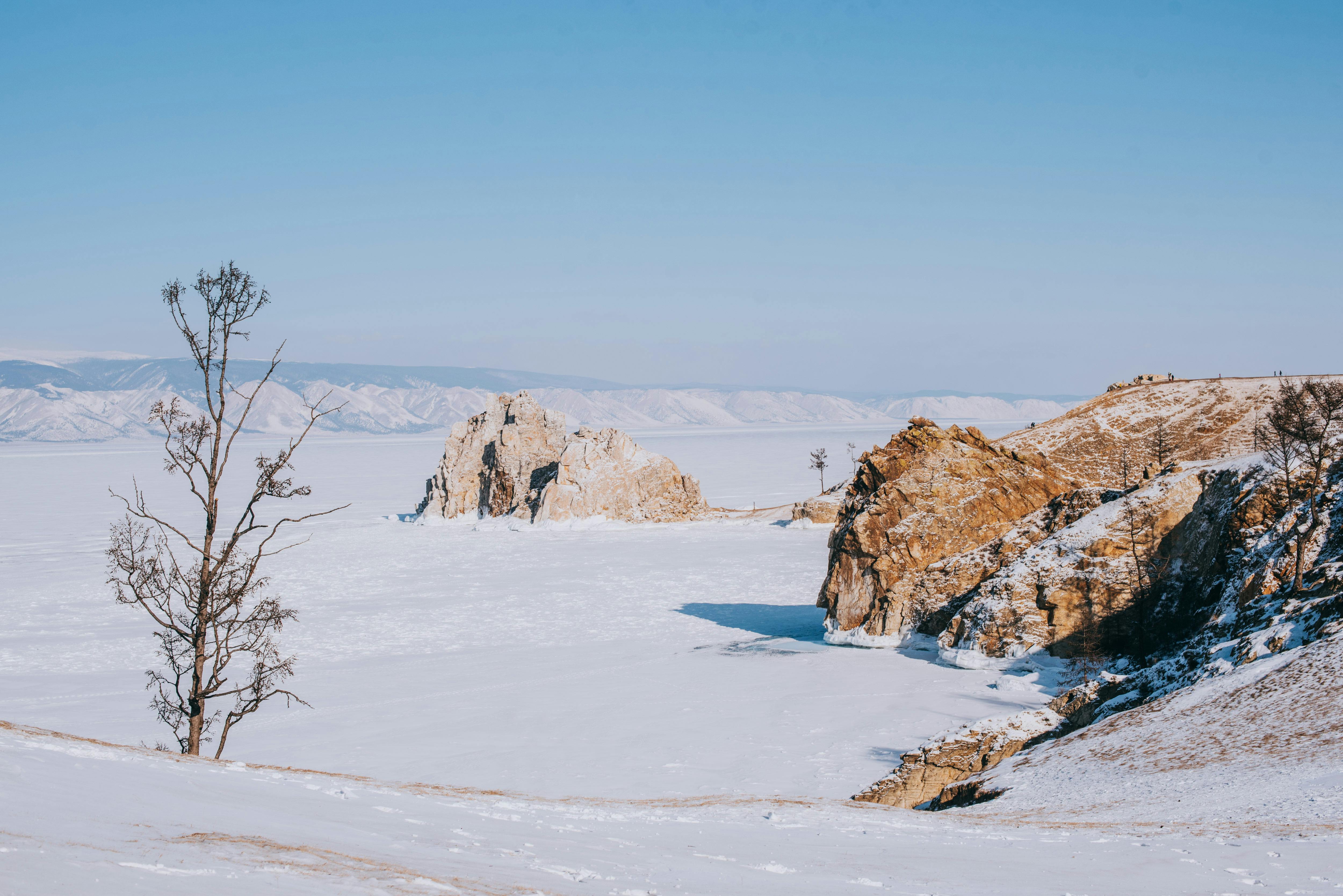 Snow Covered Ground With Brown Rocks · Free Stock Photo