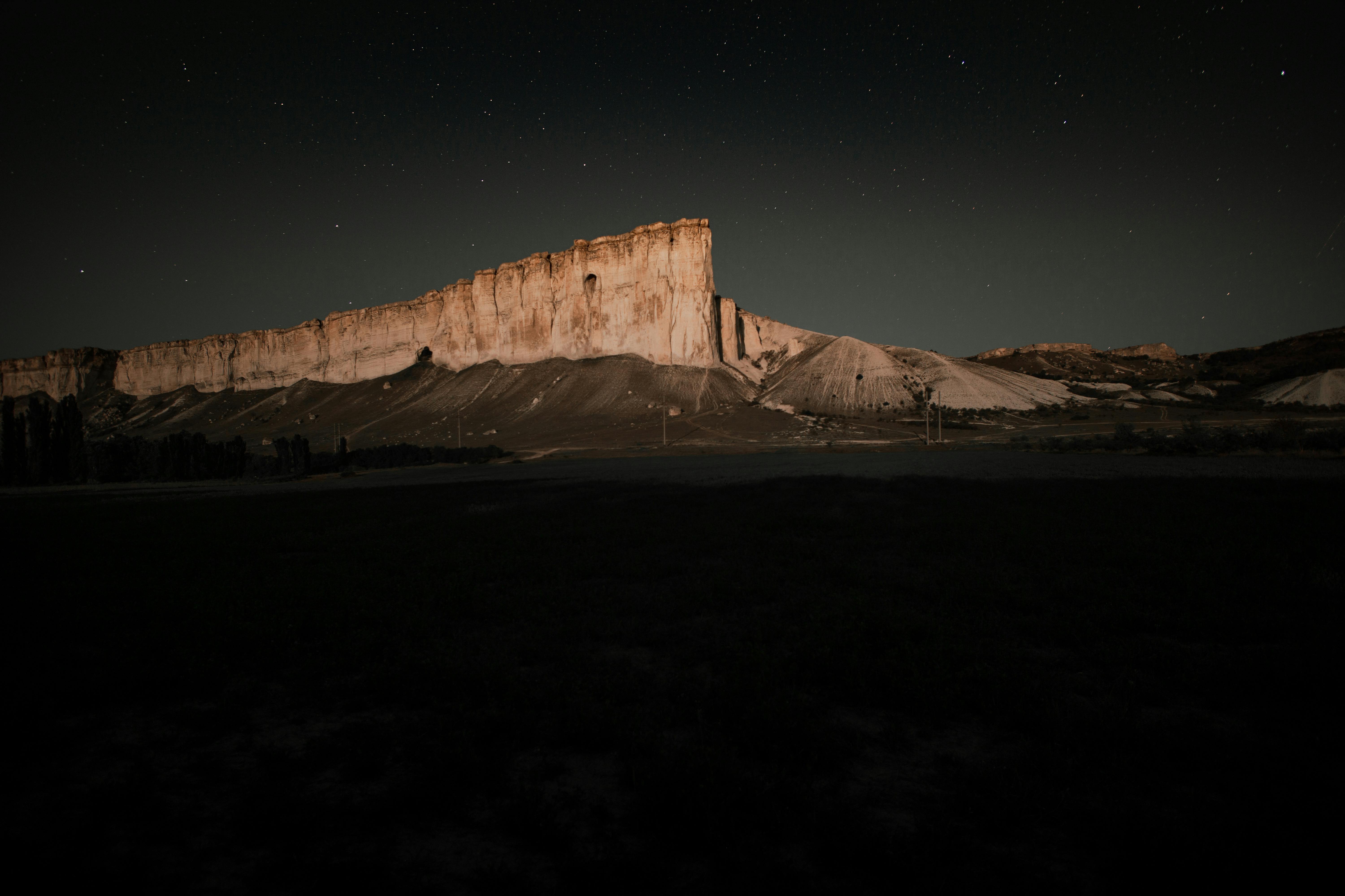 A Cliff Under a Starry Night Sky · Free Stock Photo