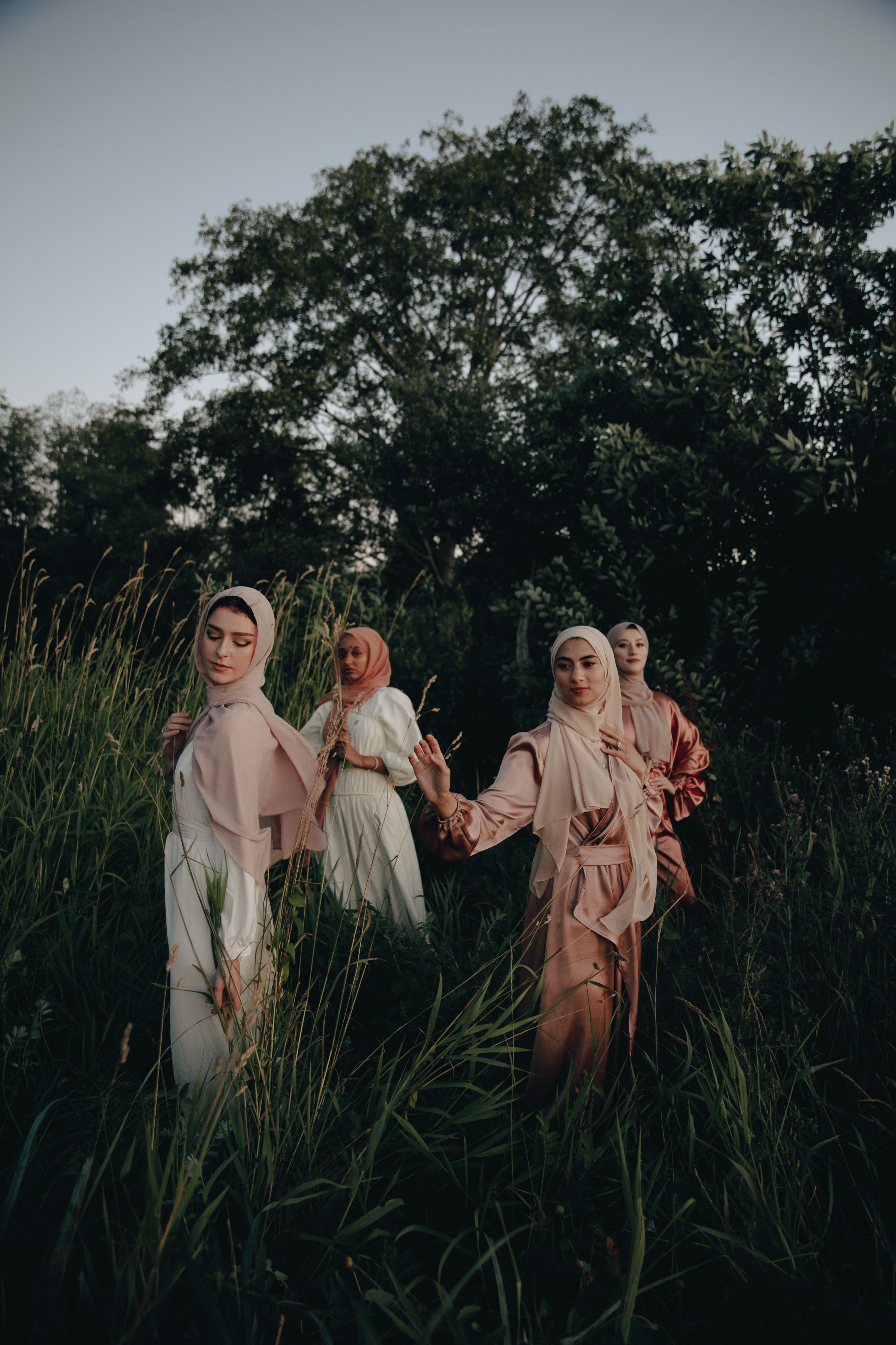 Group of Muslim Women Standing on Tall Grass · Free Stock Photo