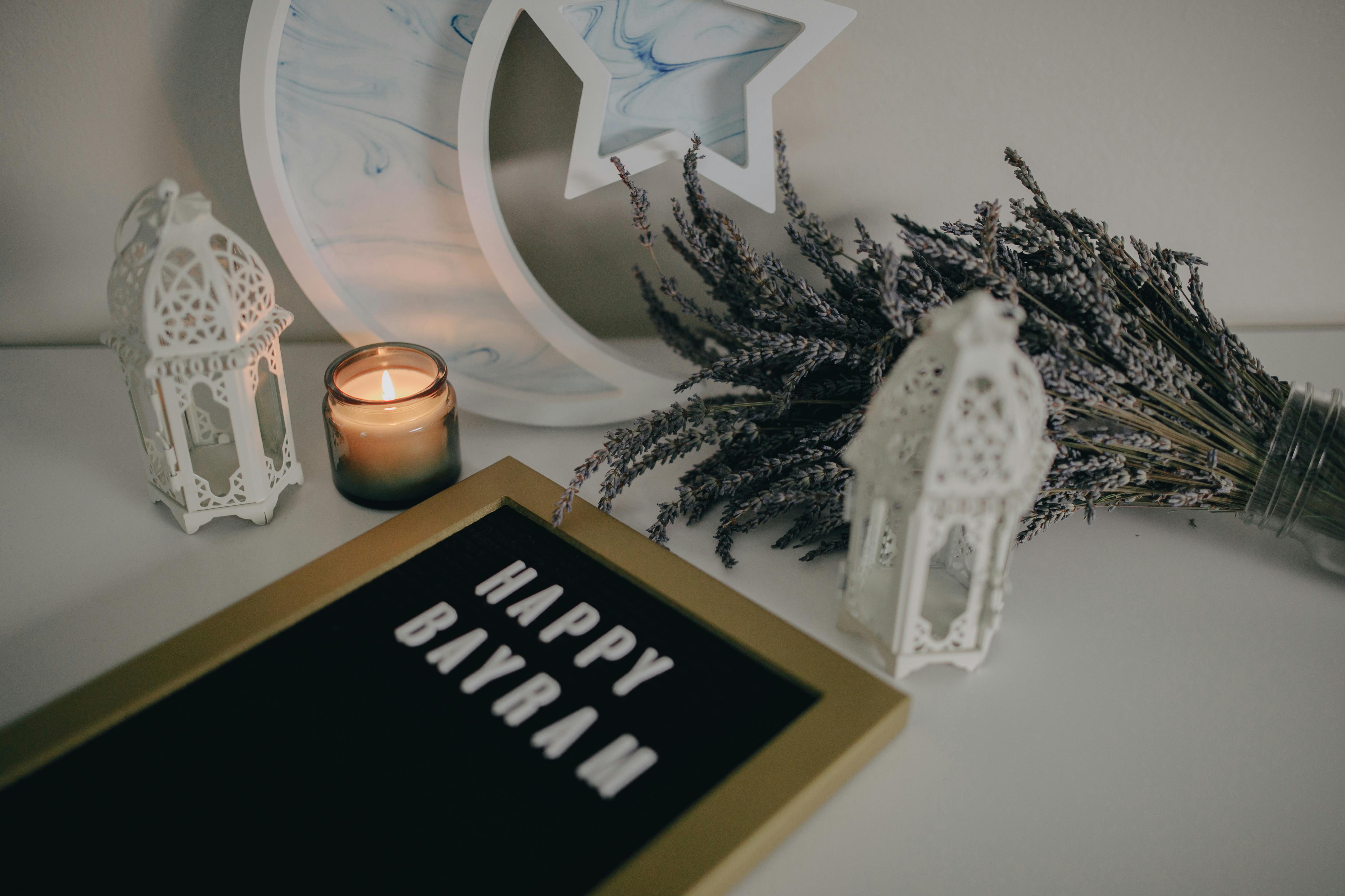 Happy Bayram Sign Beside a Lighted Candle · Free Stock Photo