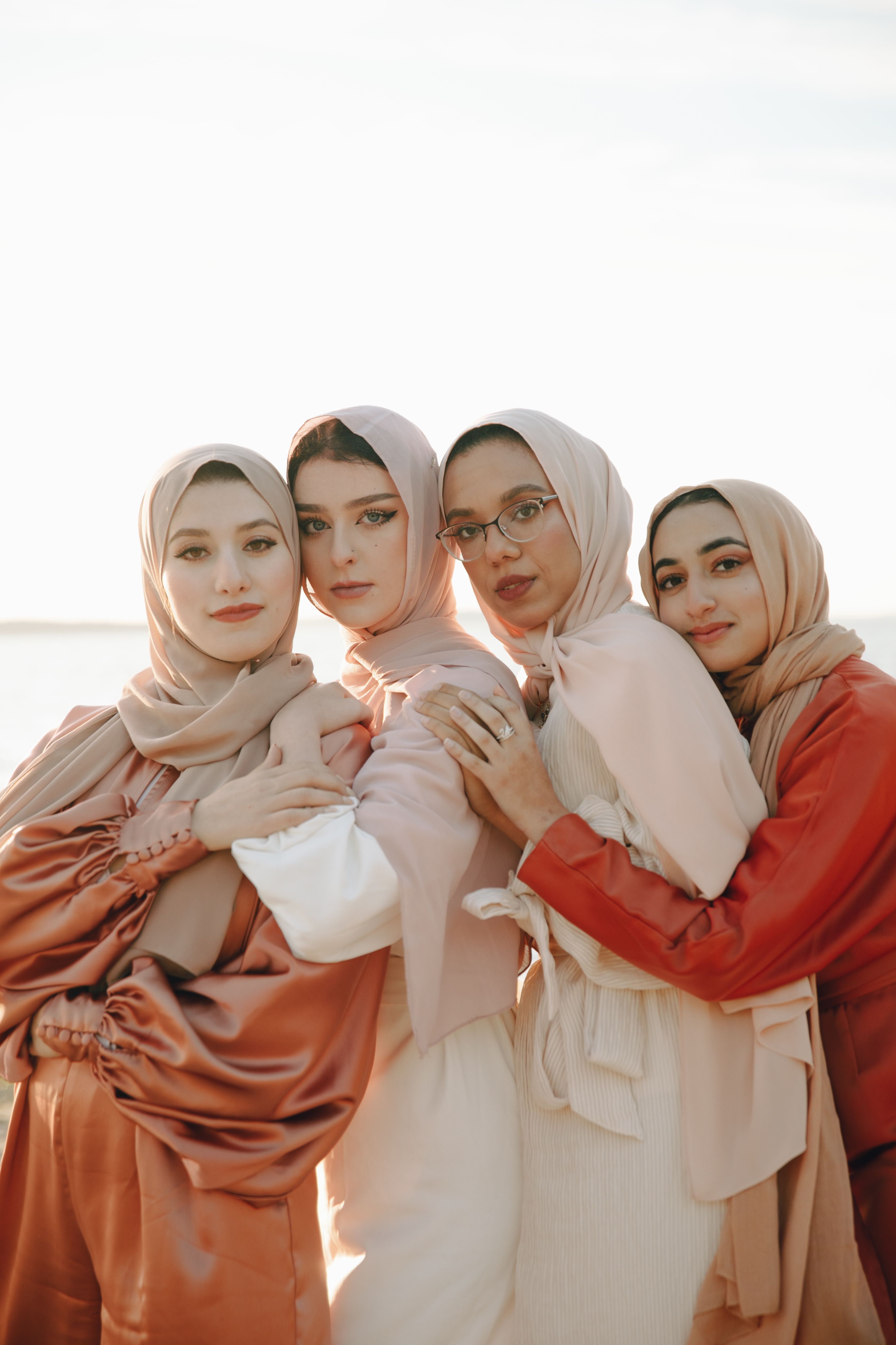 Women in Hijabs Posing Together · Free Stock Photo