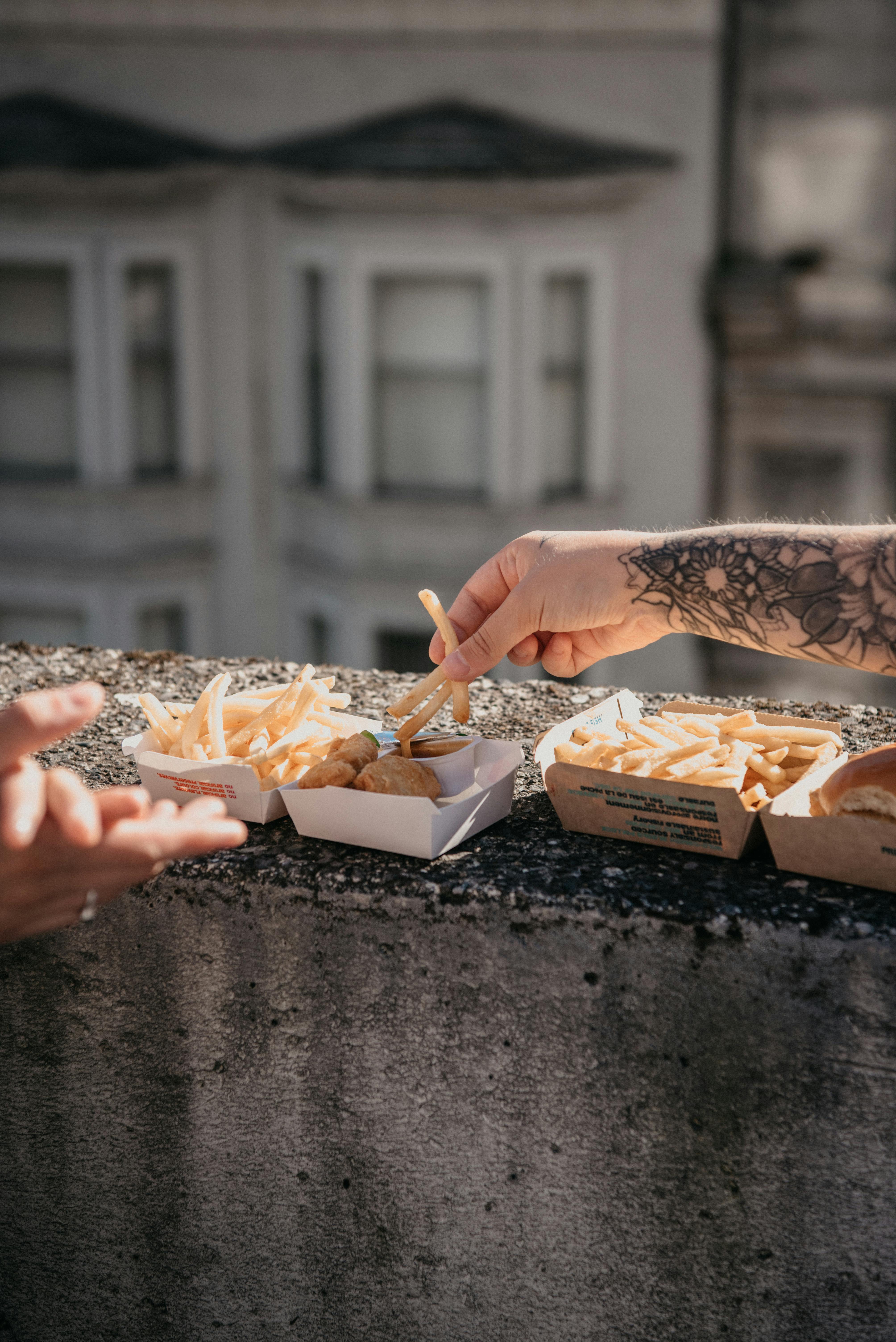 Person Holding Fries · Free Stock Photo