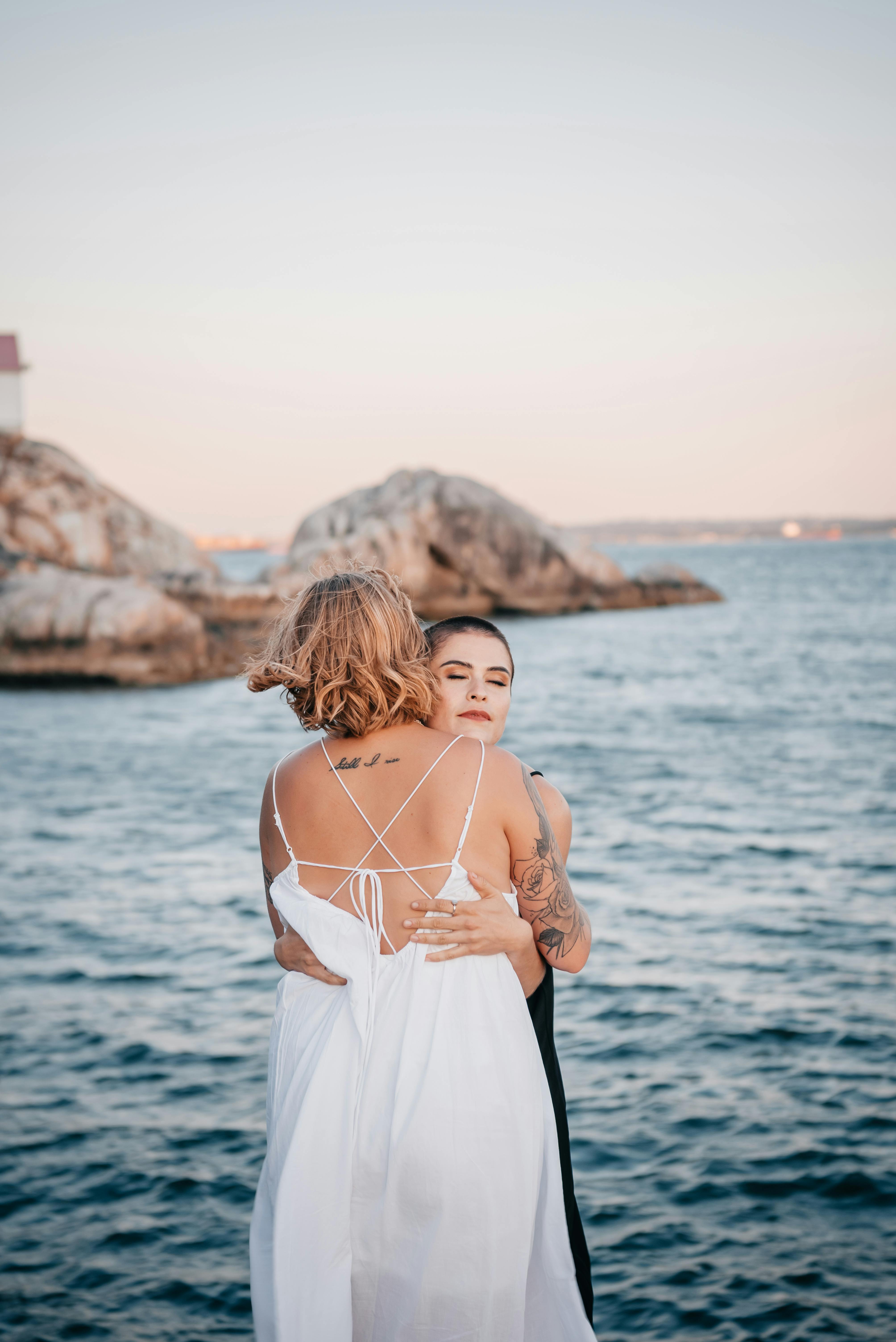 Young Couple Hugging in Water · Free Stock Photo