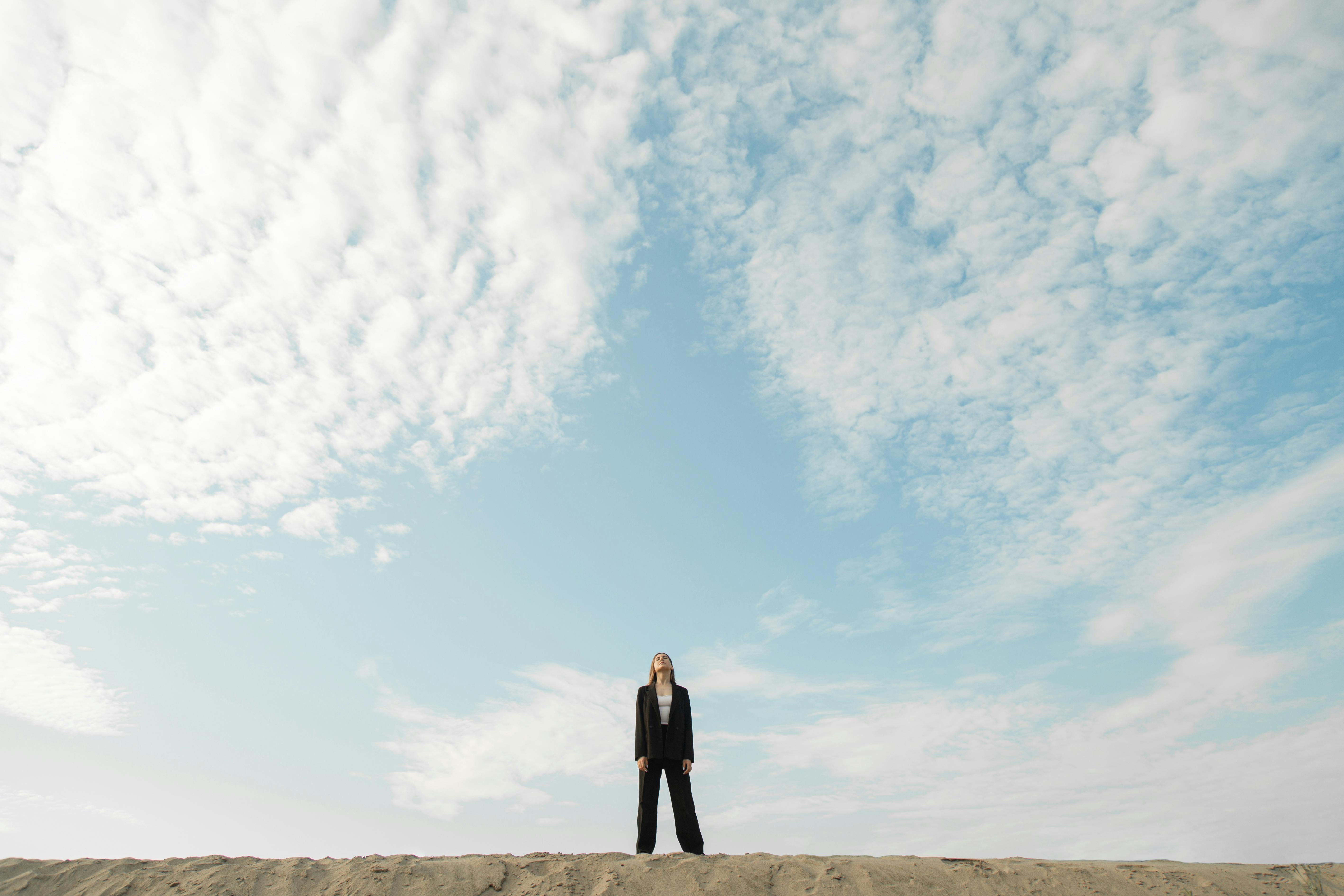 Woman on Bicycle Looking at Sky · Free Stock Photo