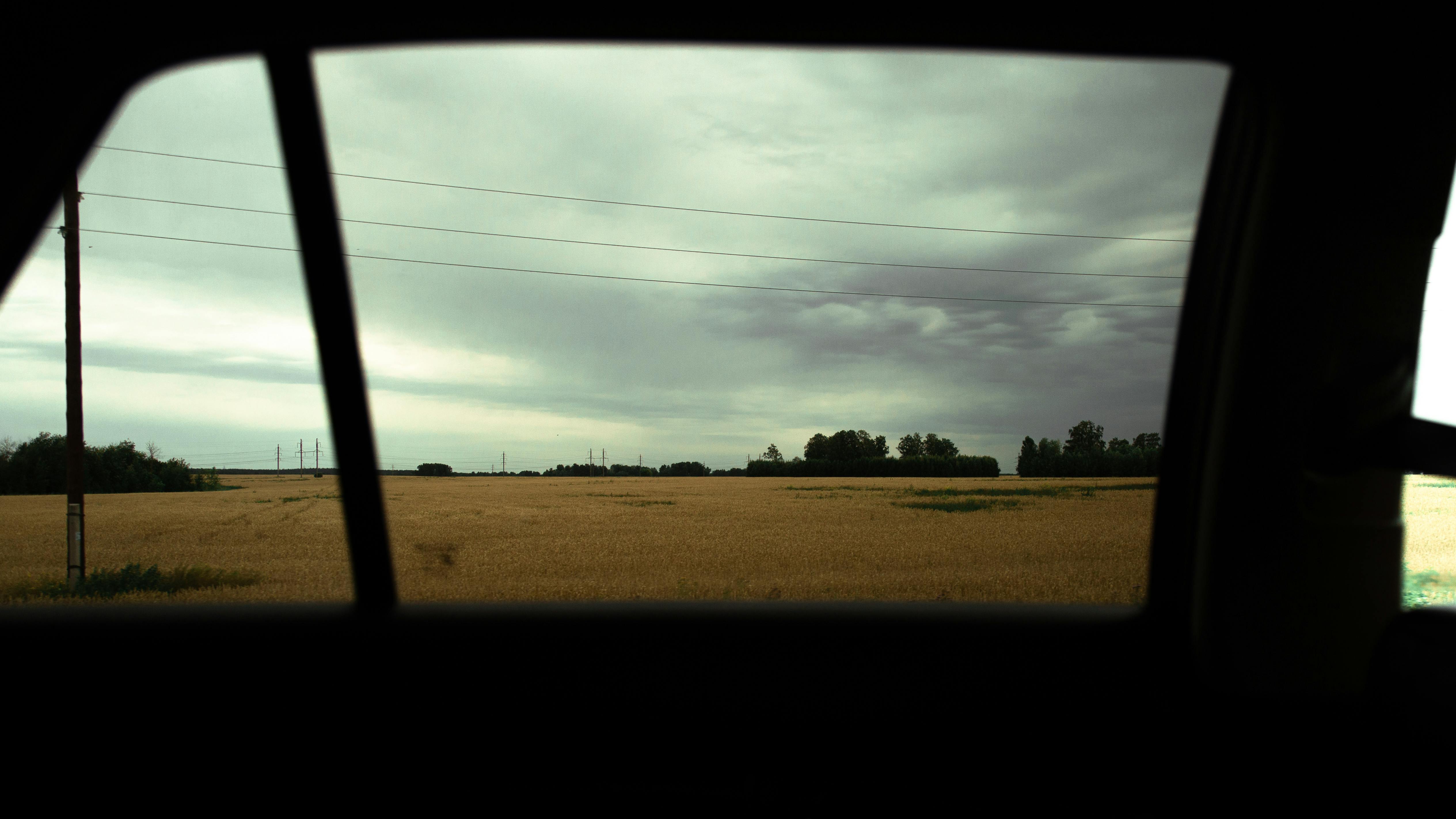View of a Field from a Vehicle's Window · Free Stock Photo