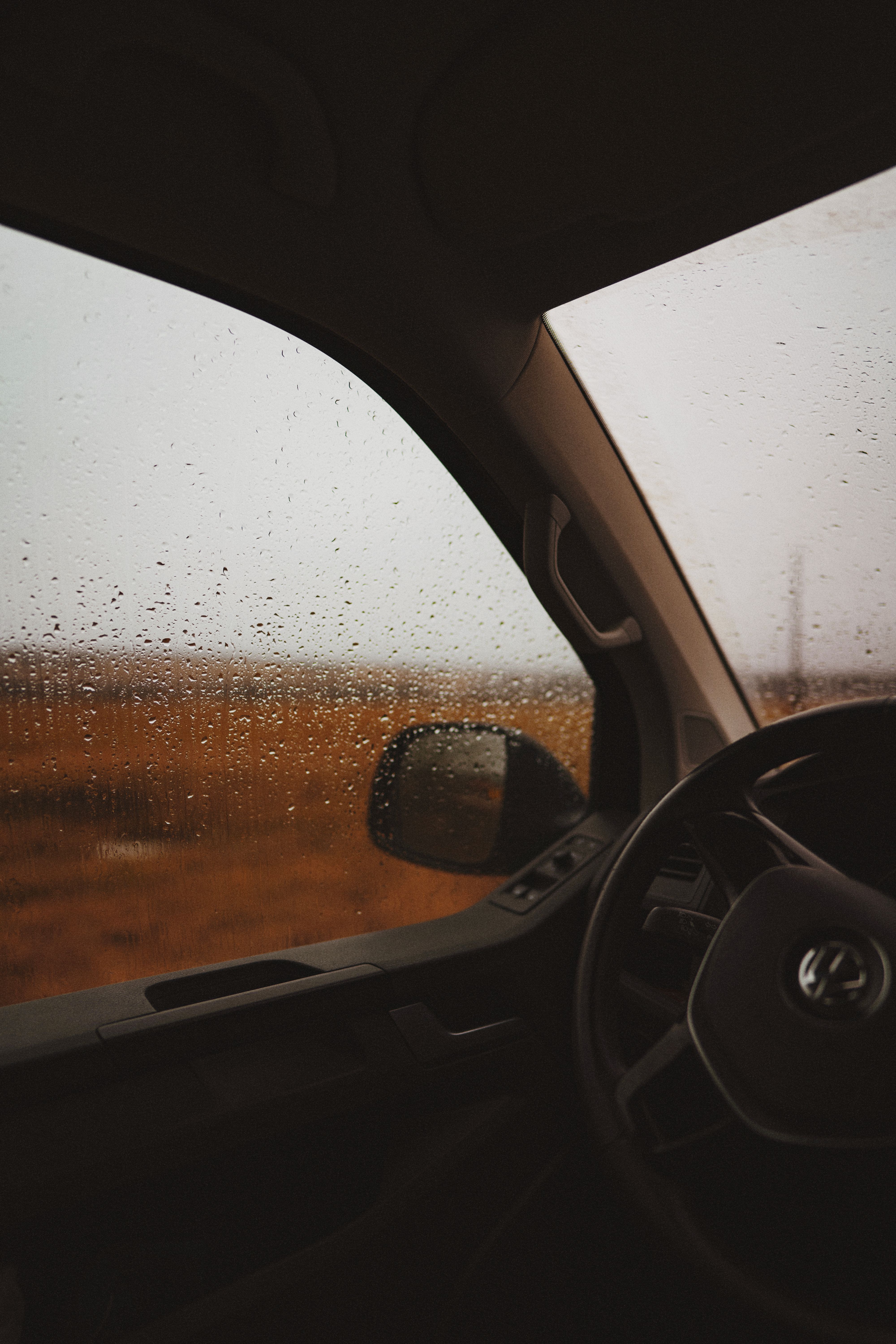 A Car with Raindrops on the Road · Free Stock Photo