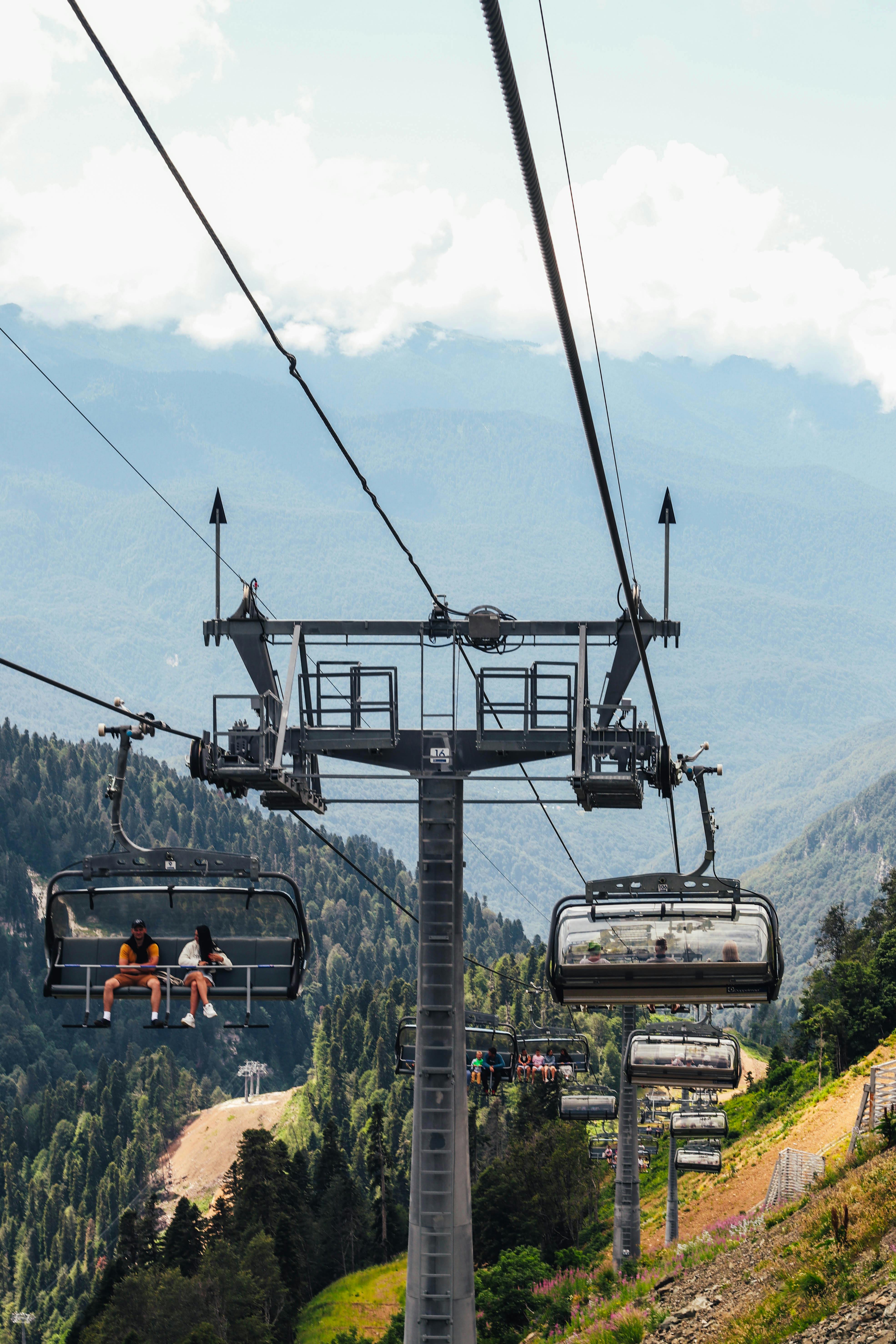 People Riding on Cable Cars · Free Stock Photo