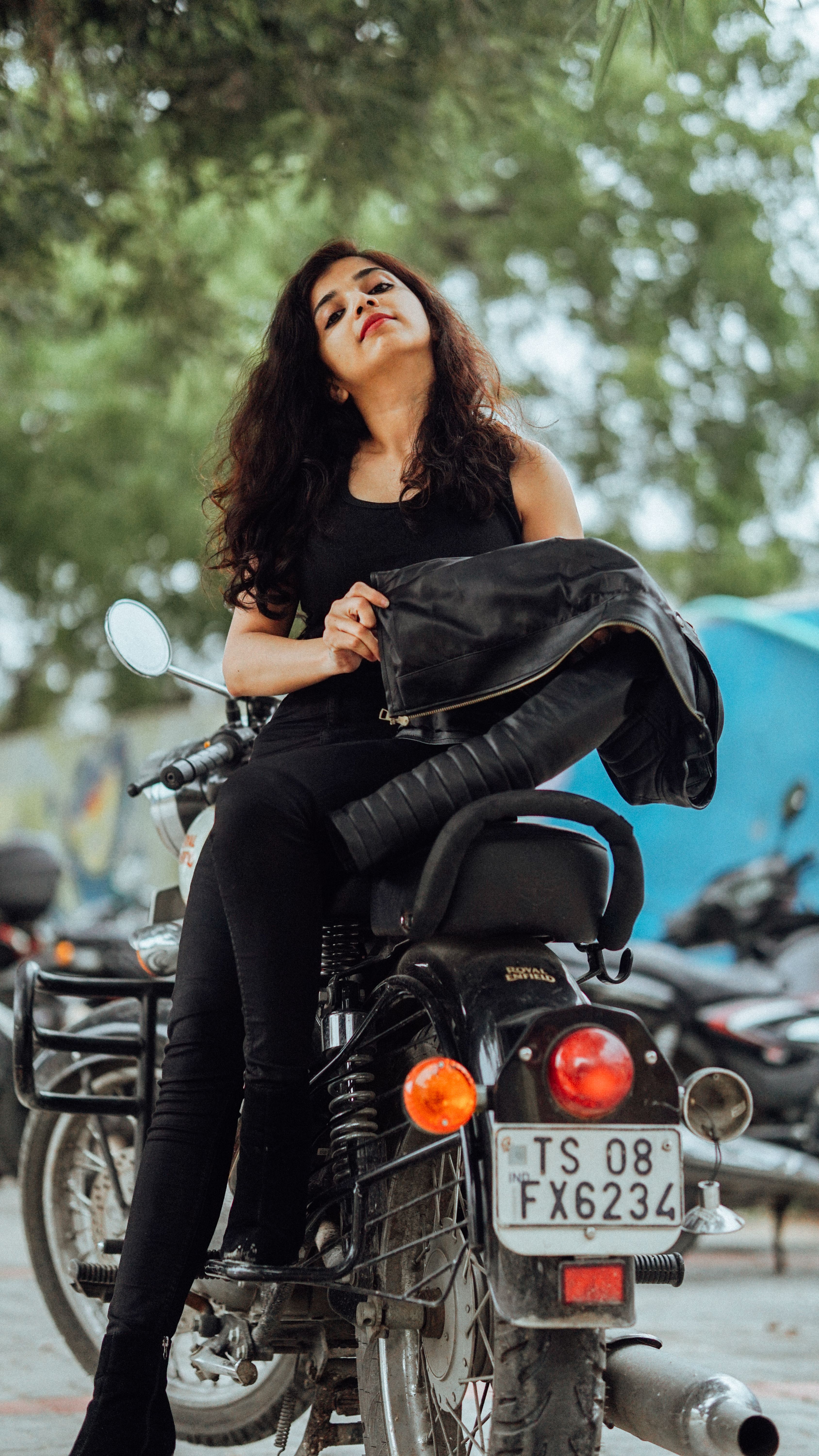 Woman Riding a Motorcycle · Free Stock Photo