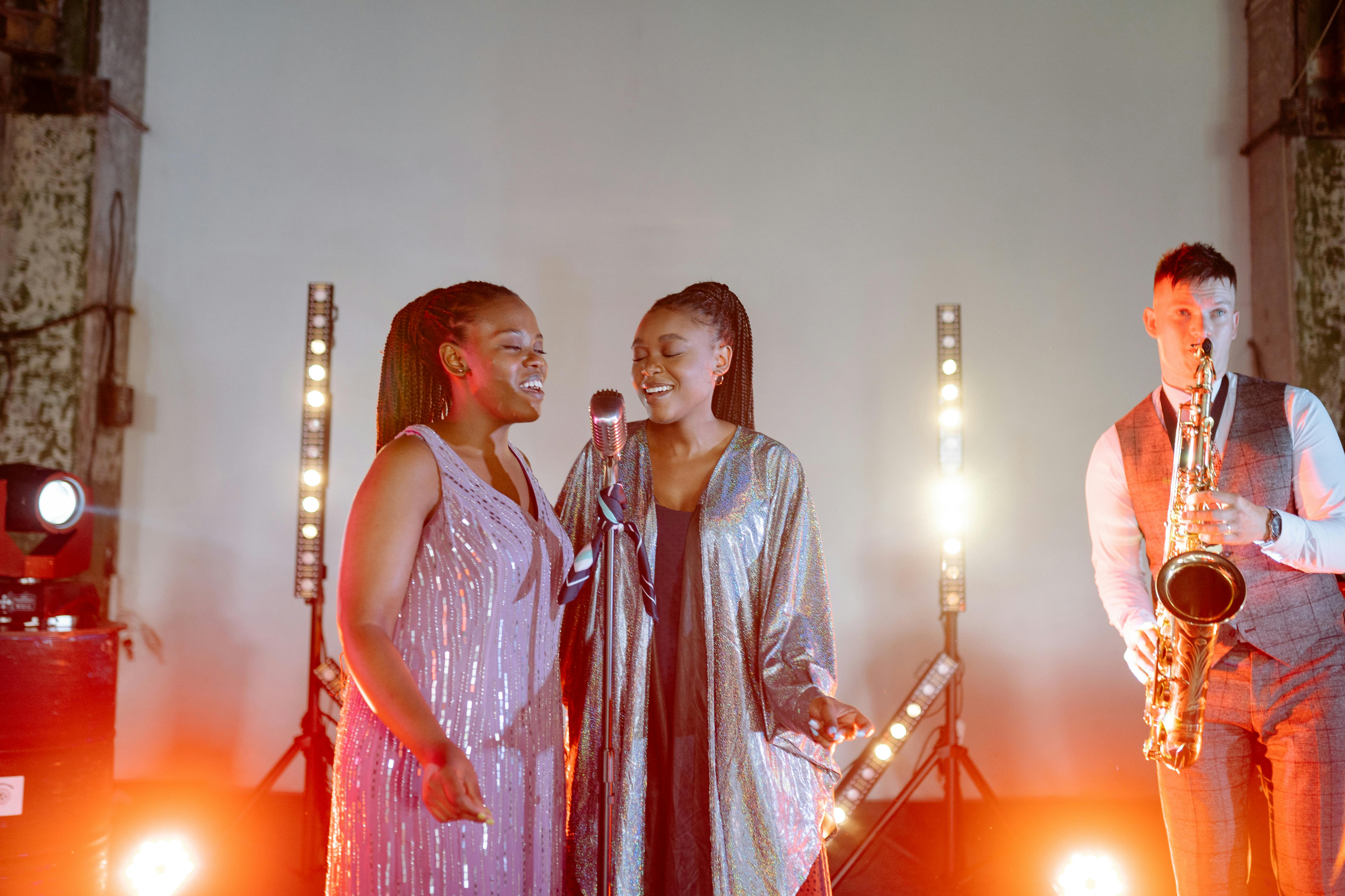 A Group of Elegant Musicians in a Live Performance · Free Stock Photo