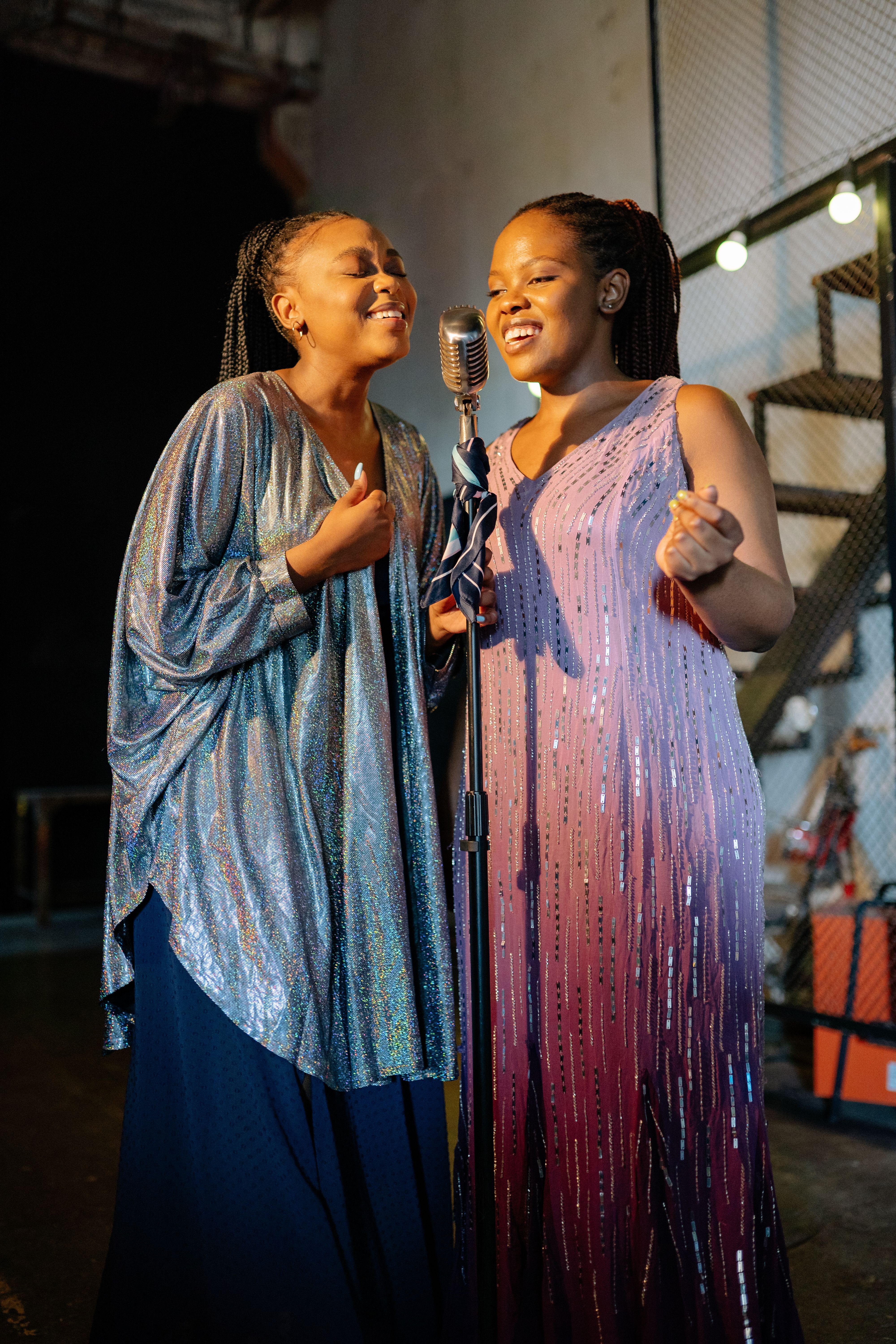 Beautiful Women Standing while Singing Together · Free Stock Photo