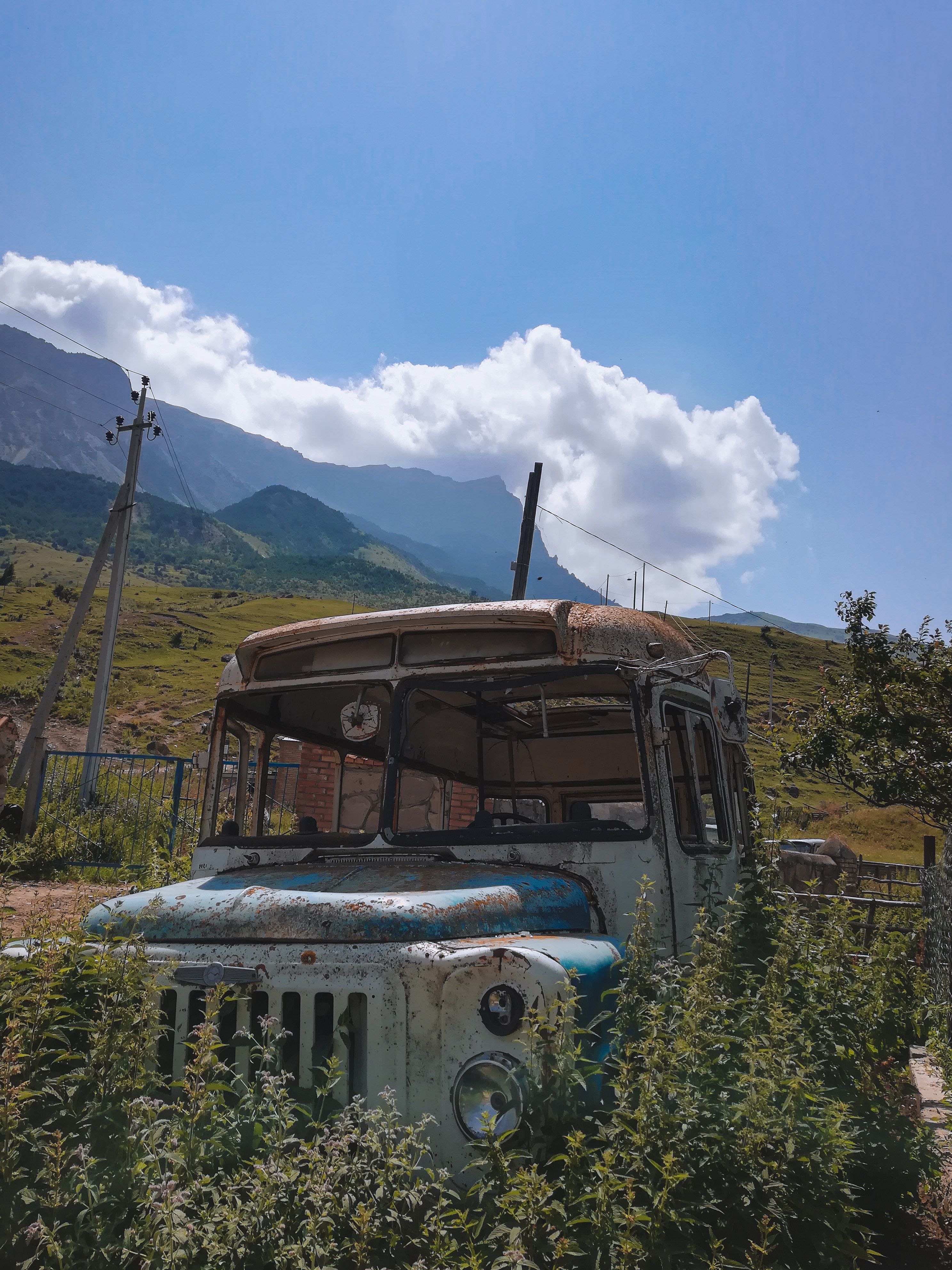 Abandoned Bus on Green Grass Field · Free Stock Photo