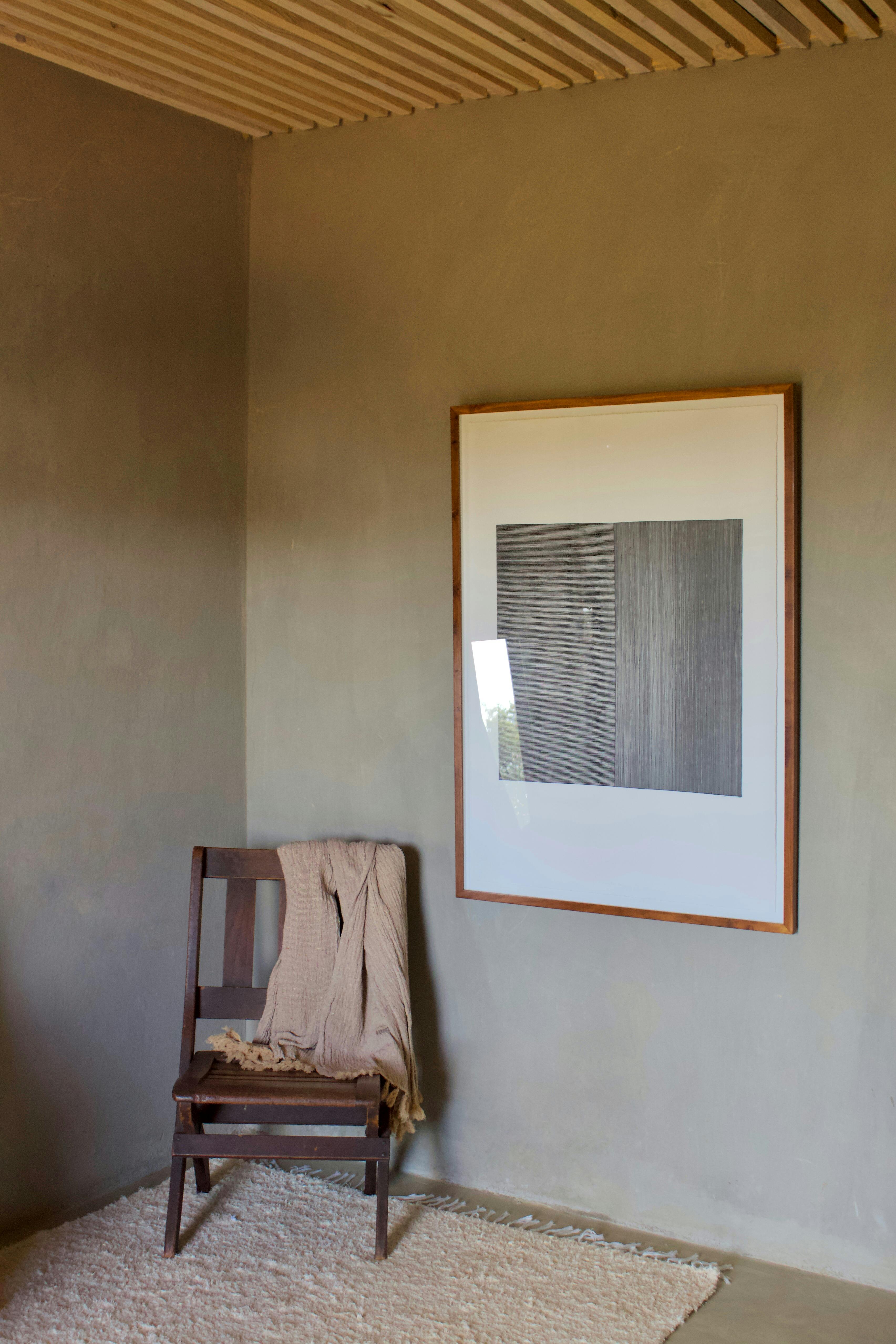 A Wooden Chair on the Corner of the Wall · Free Stock Photo