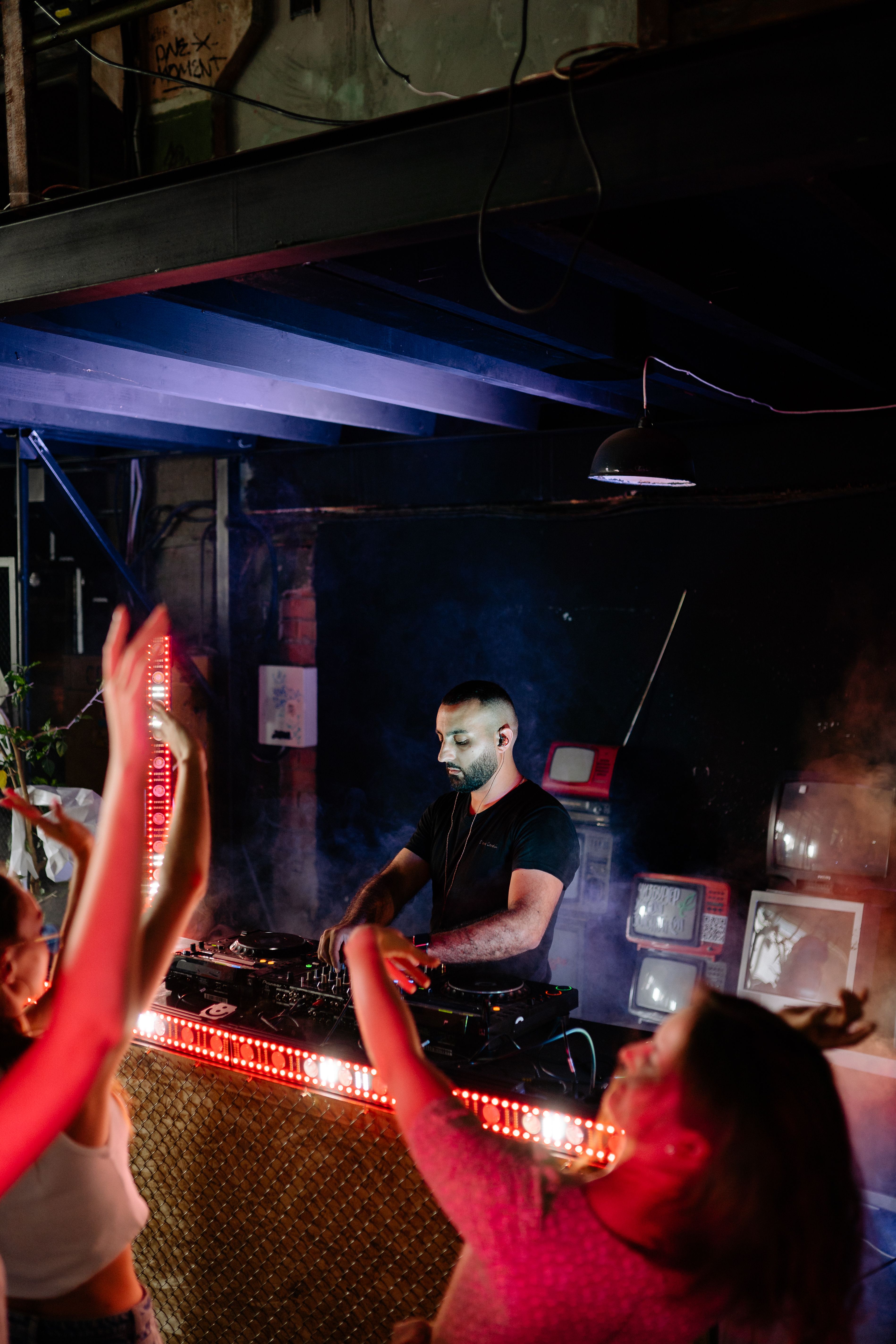 A Man Playing the Dj Mixer in a Nightclub · Free Stock Photo