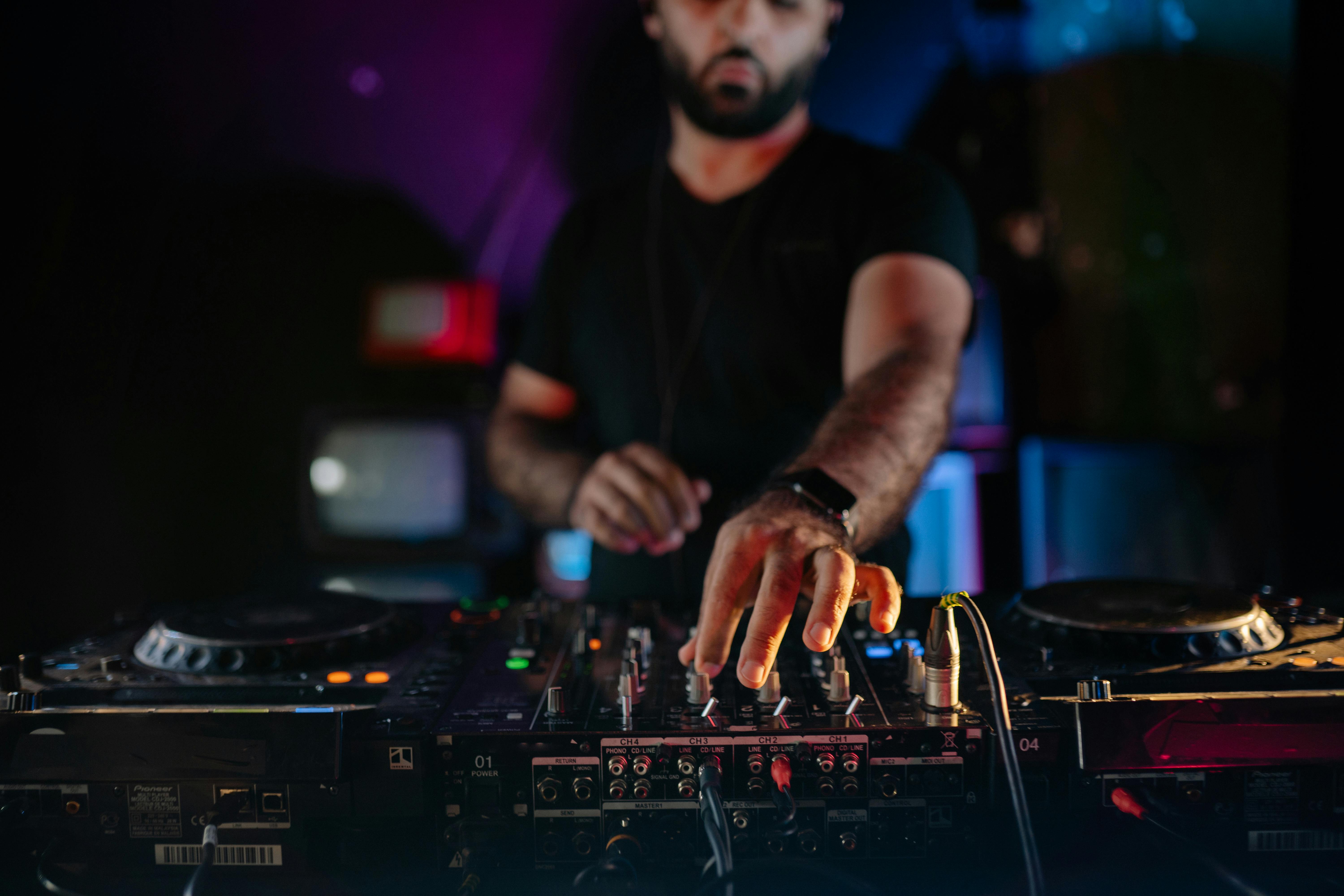Photo of Disc Jockey on Turntables · Free Stock Photo