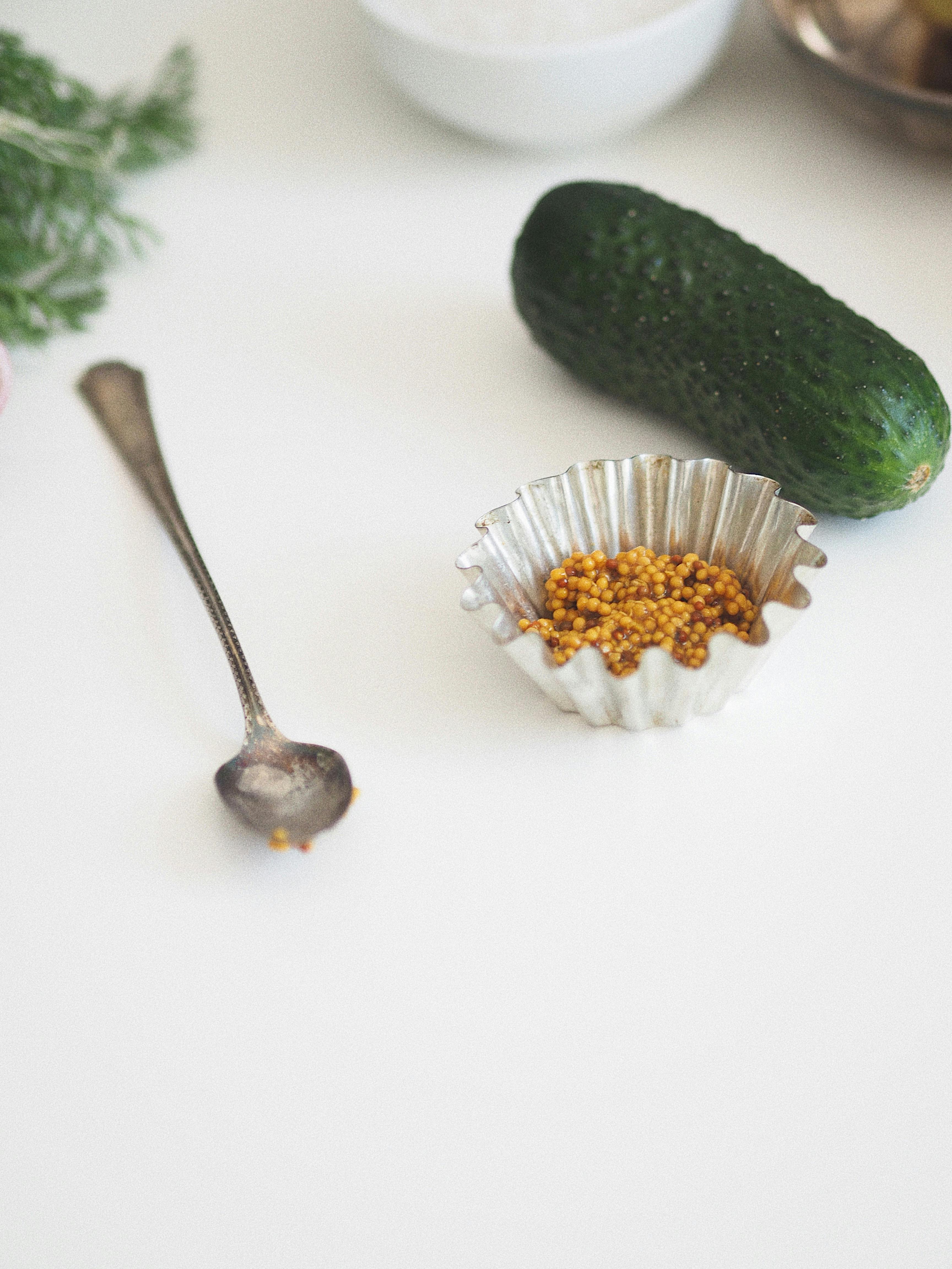 Spoon, Cucumber and Mustard on a Kitchen Counter · Free Stock Photo