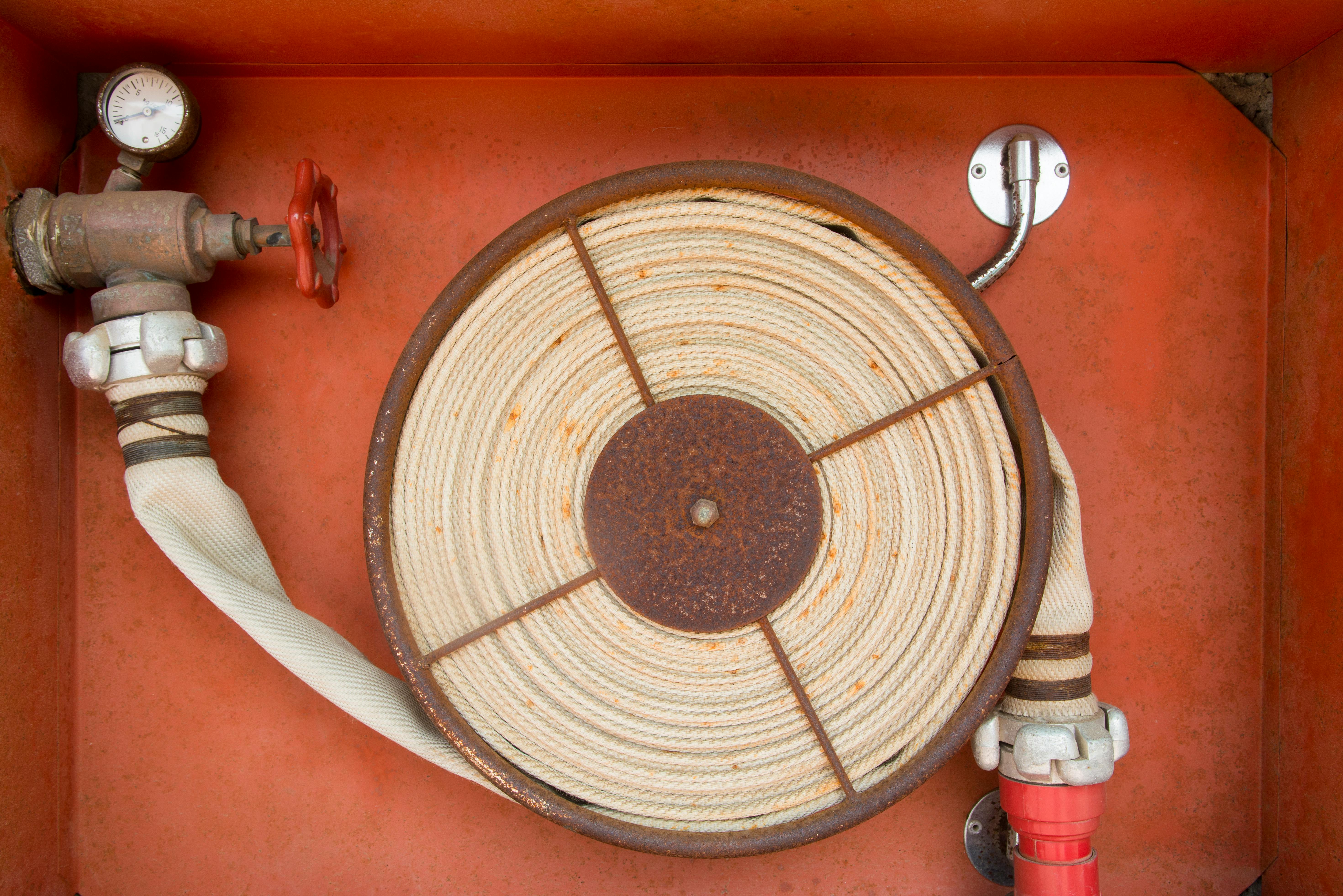 Photograph of a Rolled Fire Hose · Free Stock Photo