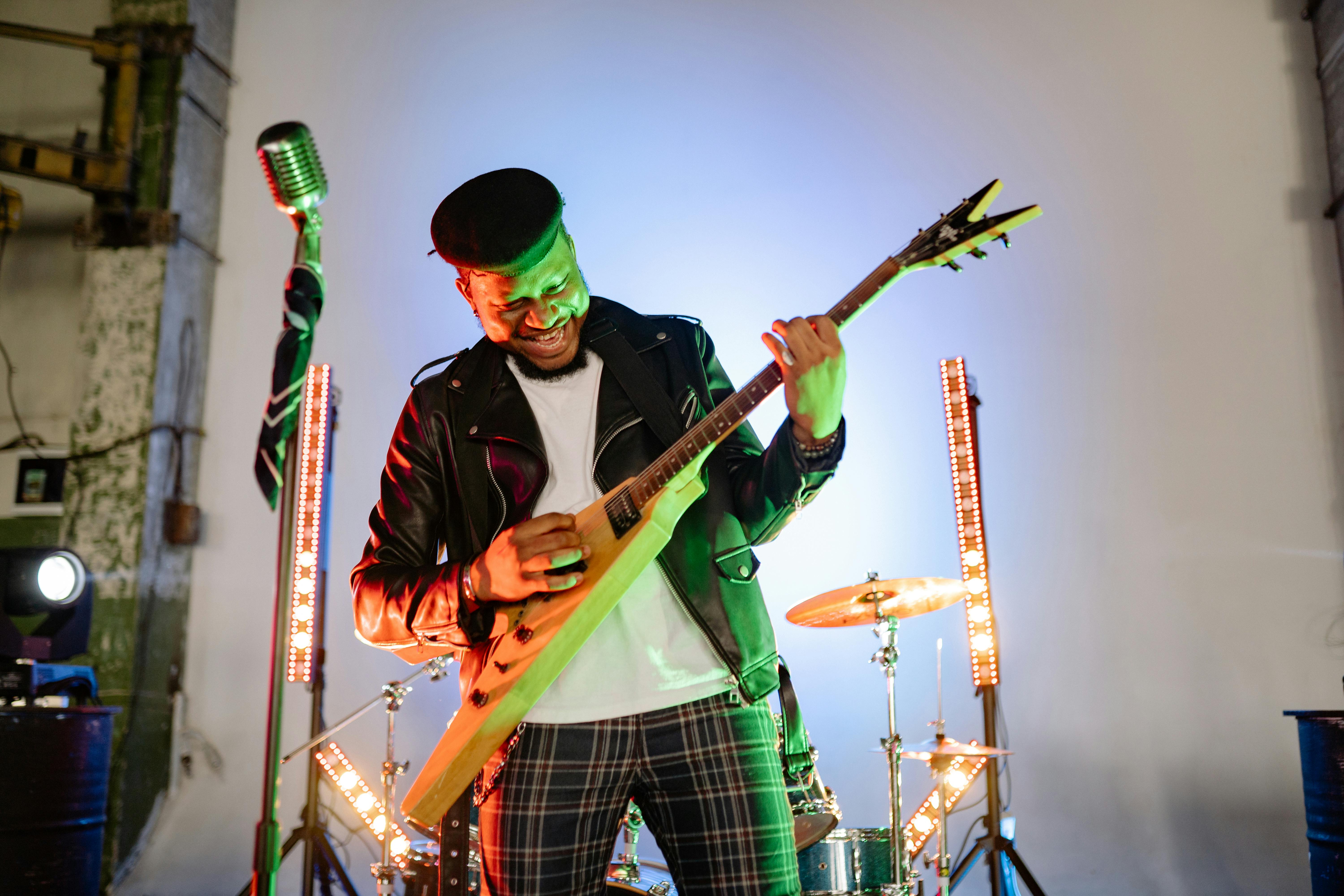 Two Men Playing Musical Instruments · Free Stock Photo