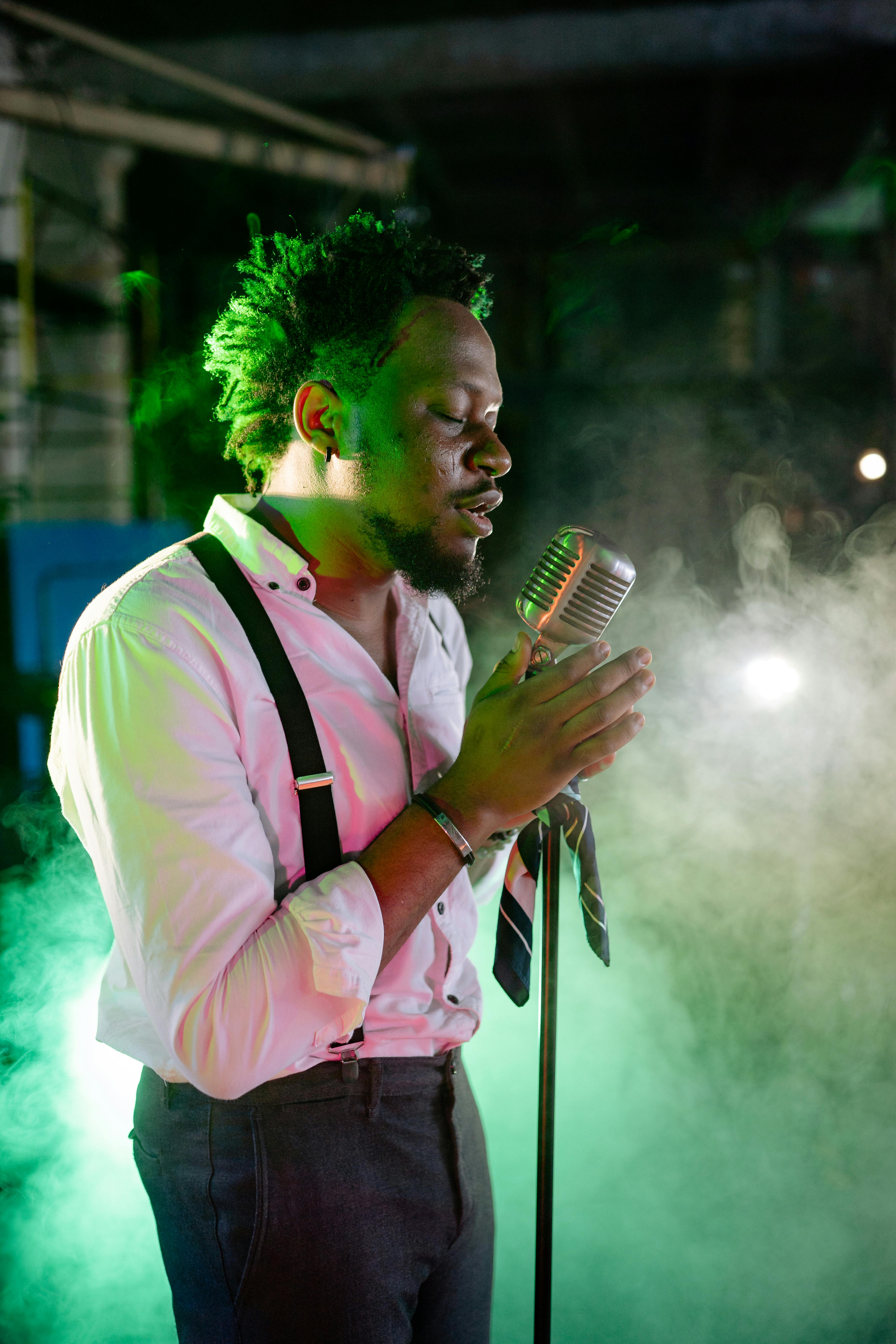 Singer During Concert on Smoky Stage · Free Stock Photo