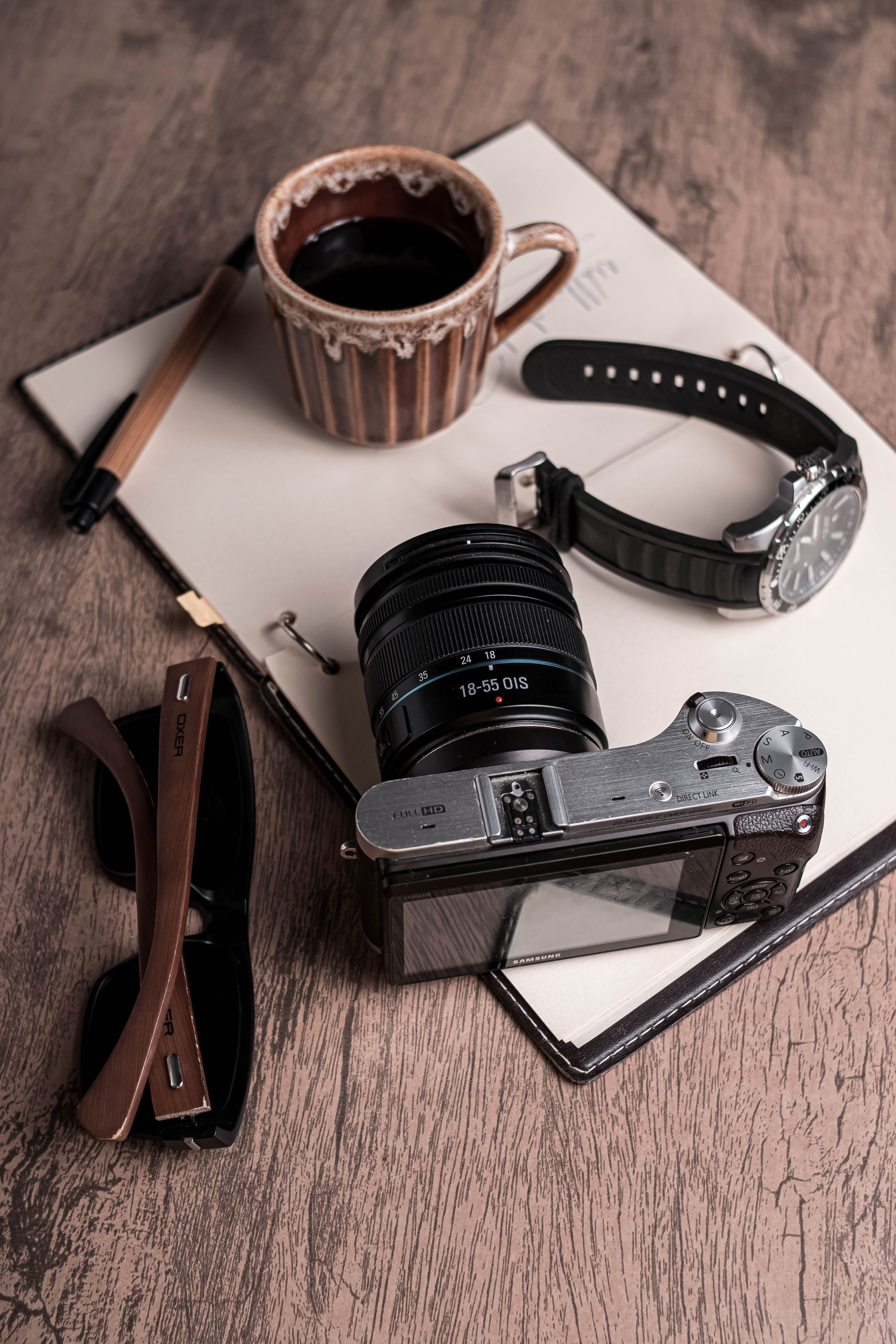 Assorted Items over a Wooden Table · Free Stock Photo