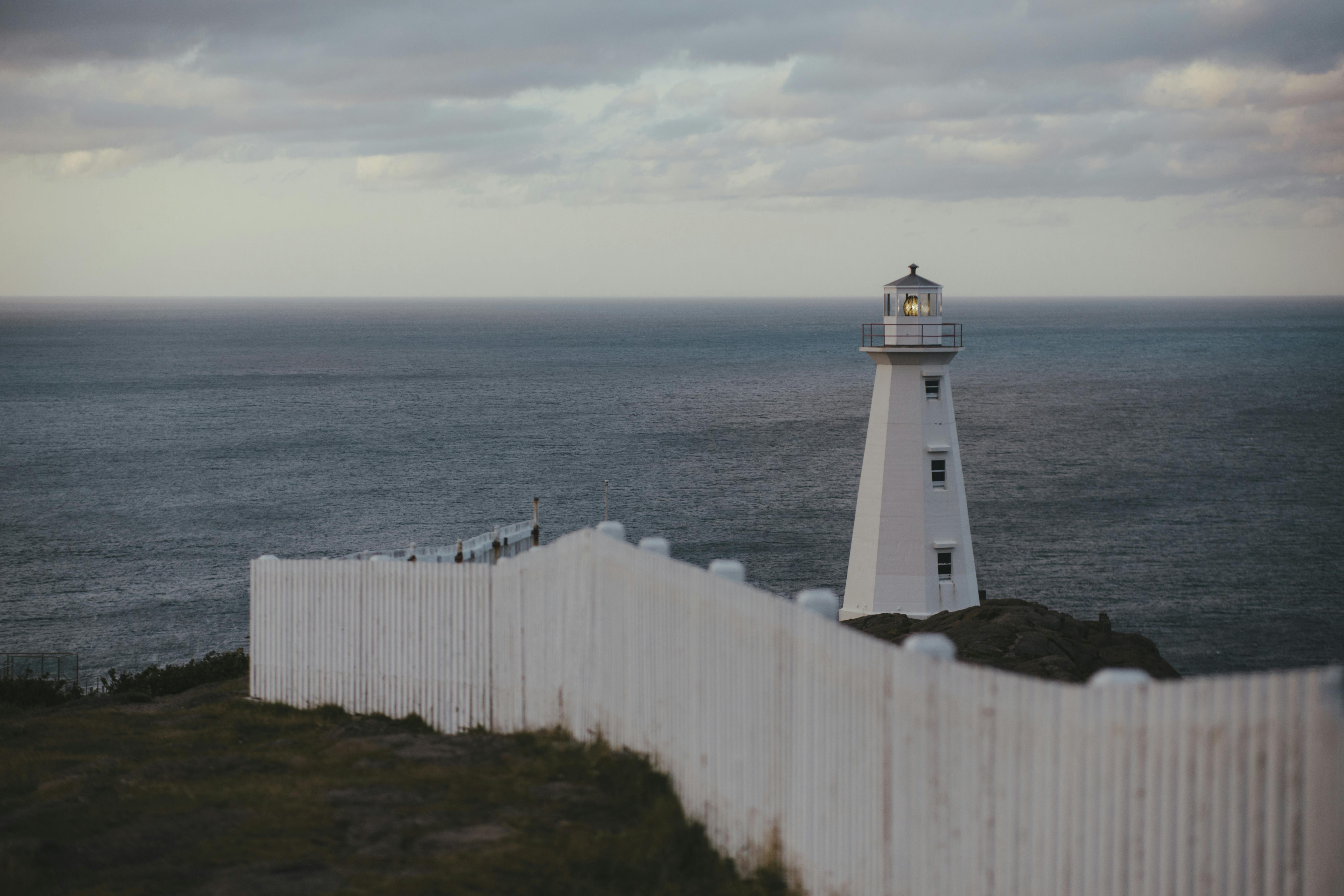 People Standing in Front of White Concrete Lighthouse during Daytime ...