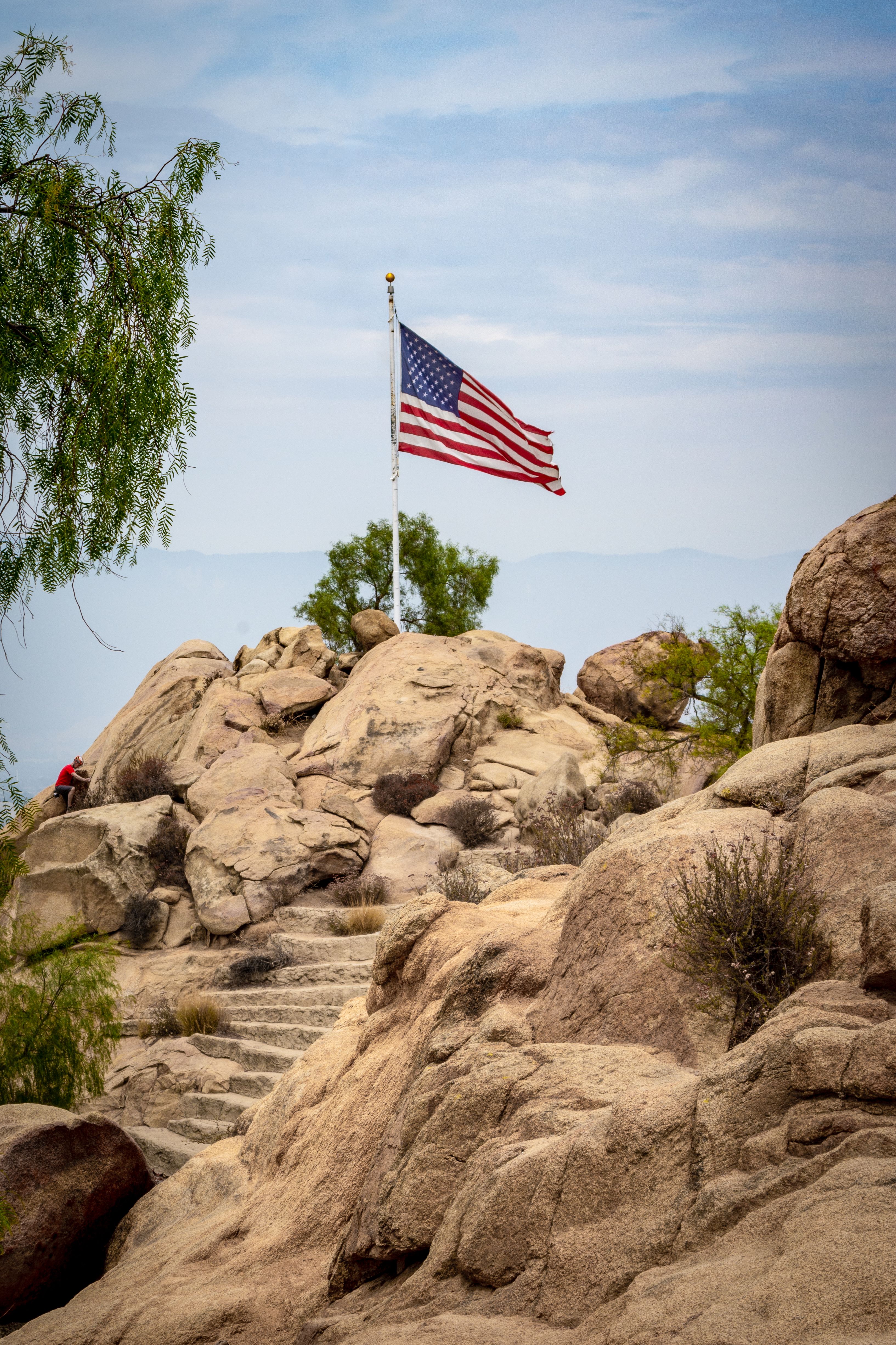 A Flag on a Rock Formation · Free Stock Photo