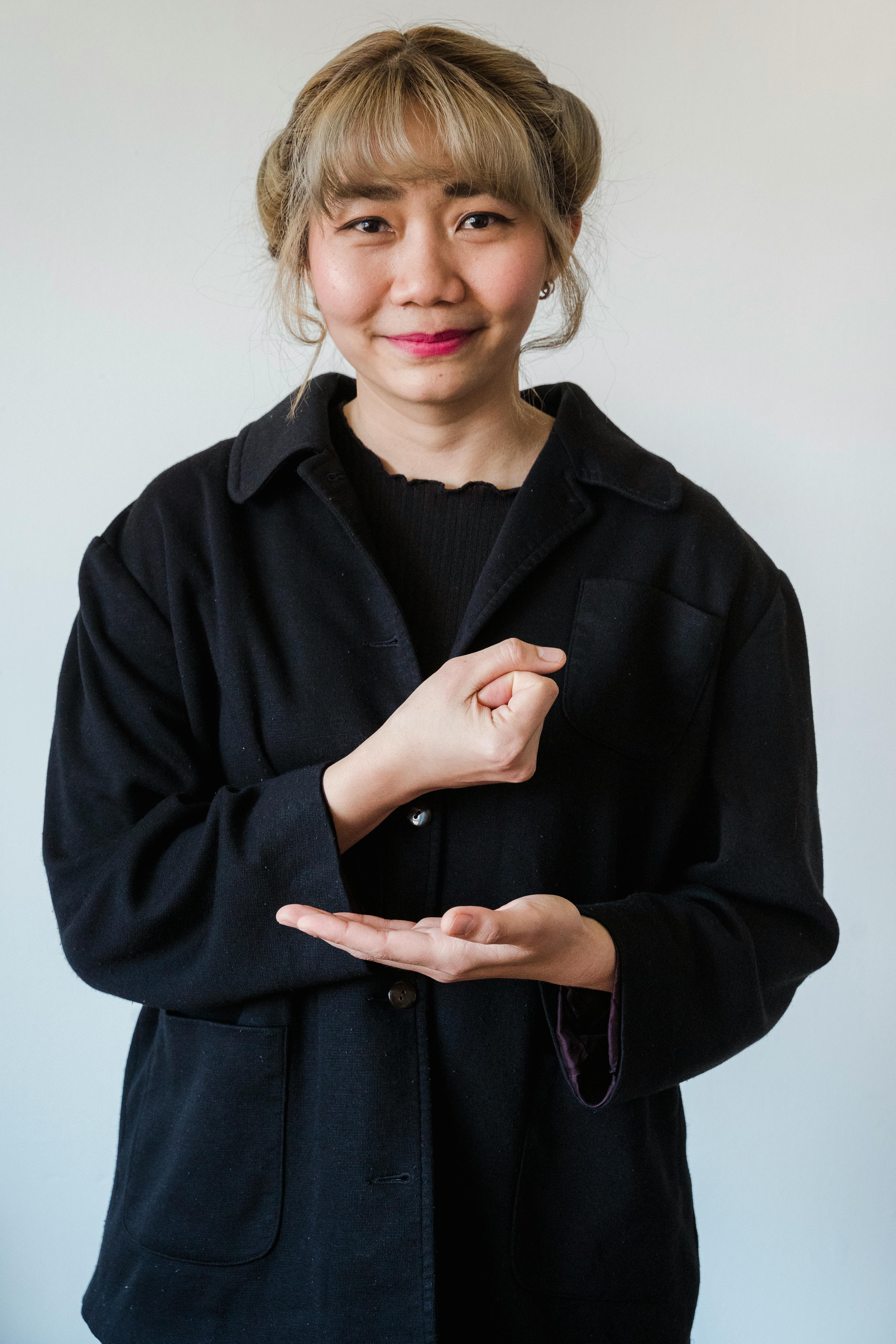 A Woman Doing Sign Language · Free Stock Photo