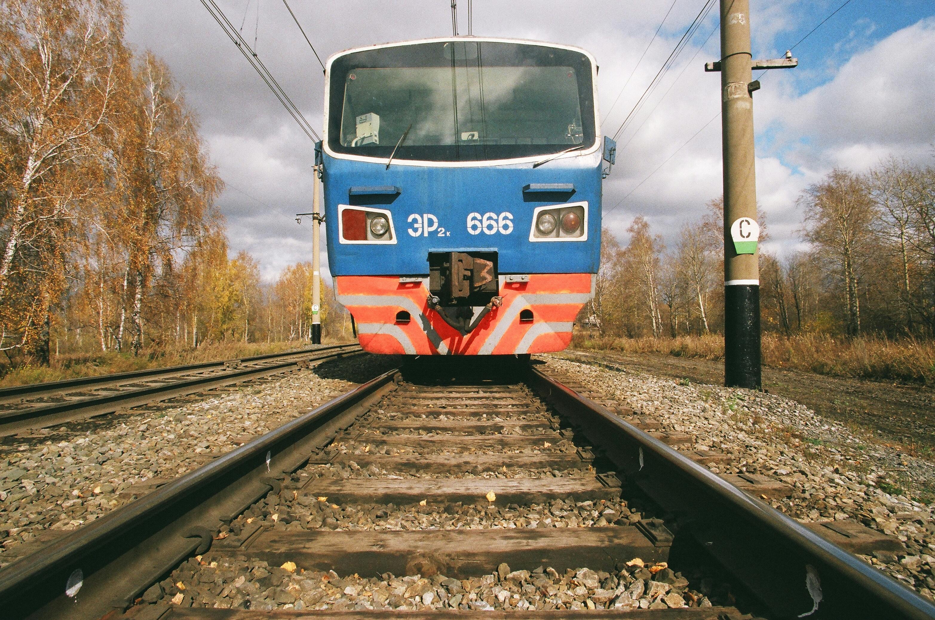 Blue White and Red Train on Rail Tracks · Free Stock Photo